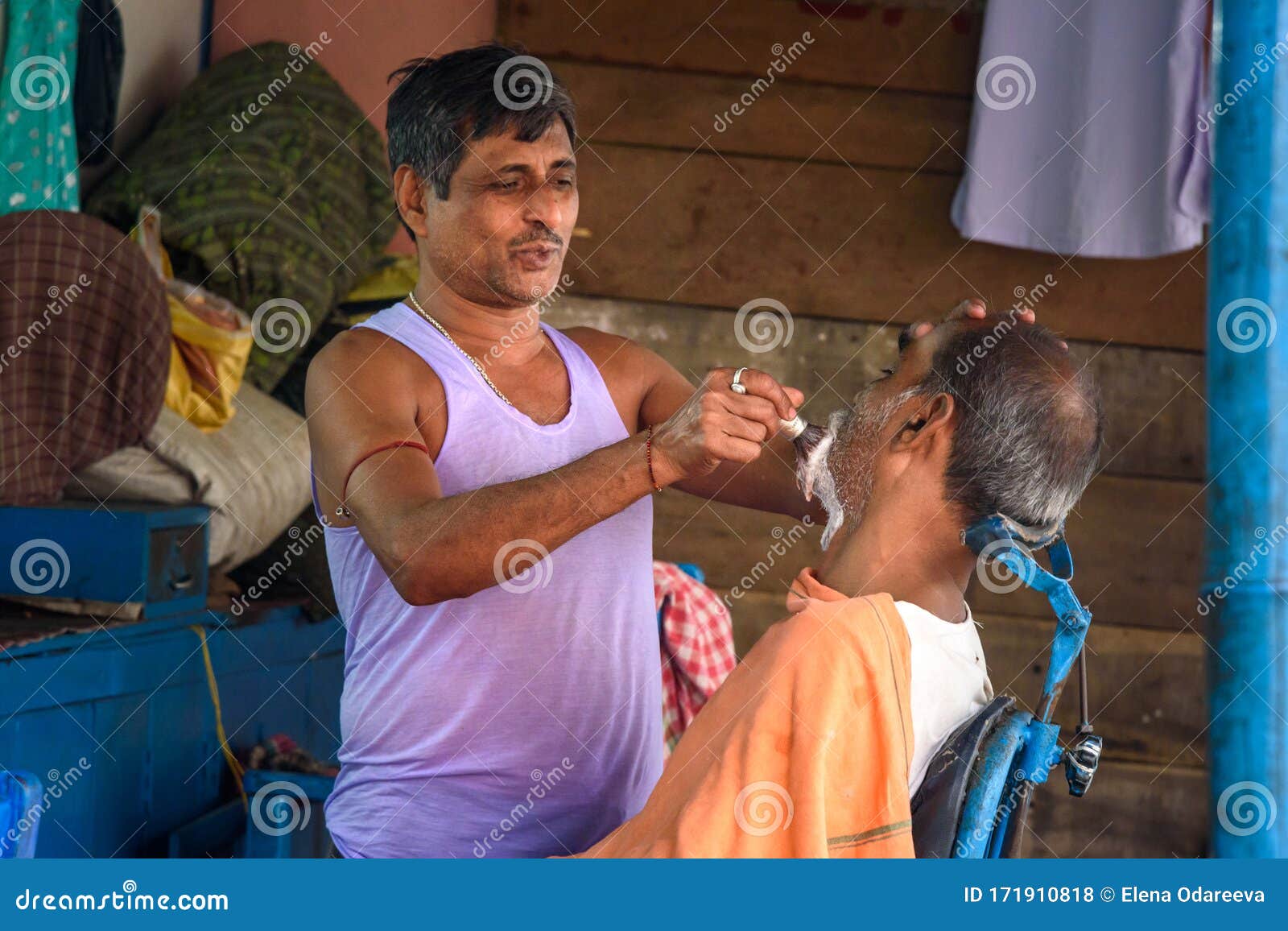 Indian Barber Shaving Man On The Street In Kolkata India Editorial