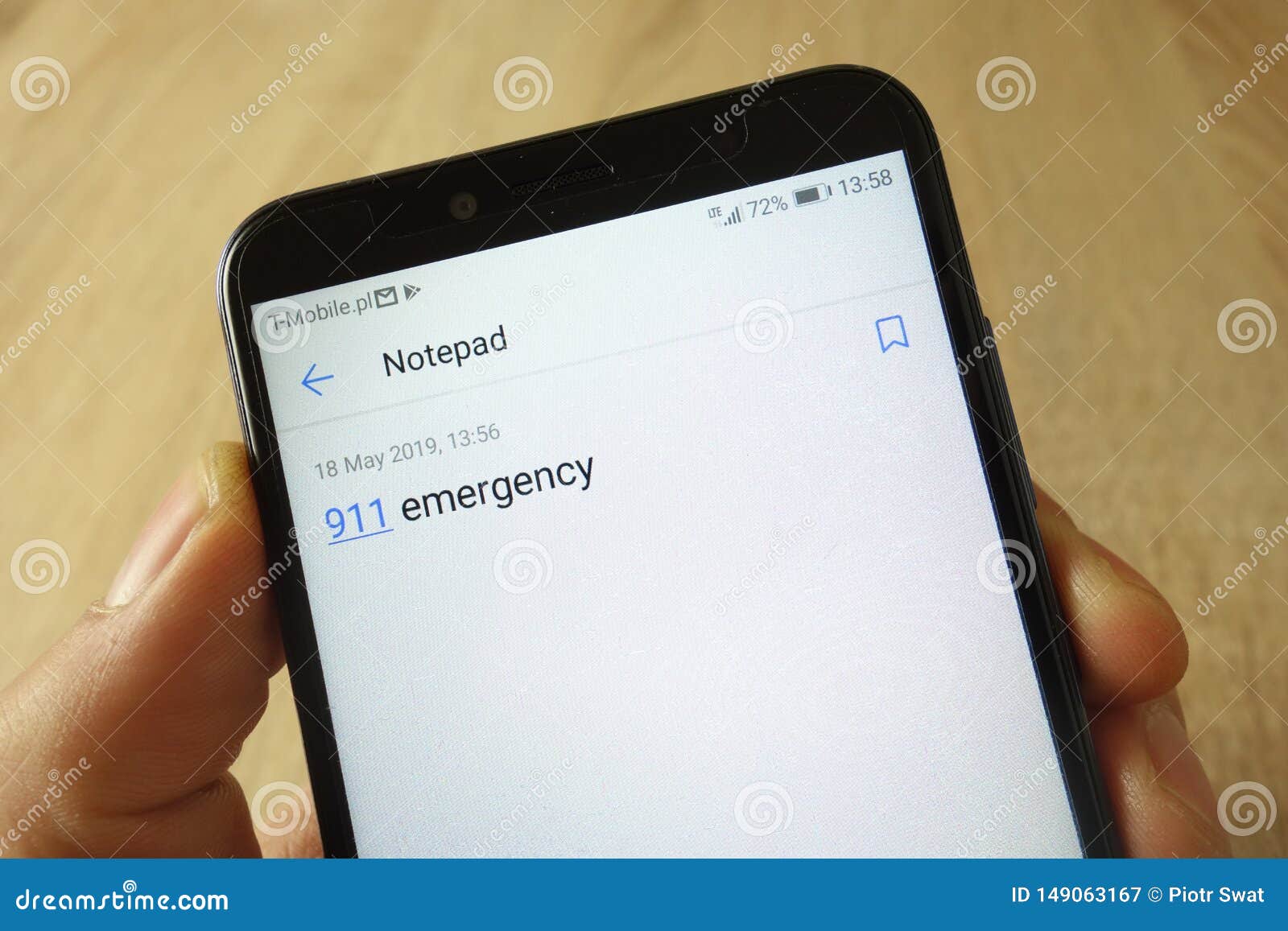 KONSKIE, POLAND - May 18, 2019: Hand Holding Smartphone with 911 ...