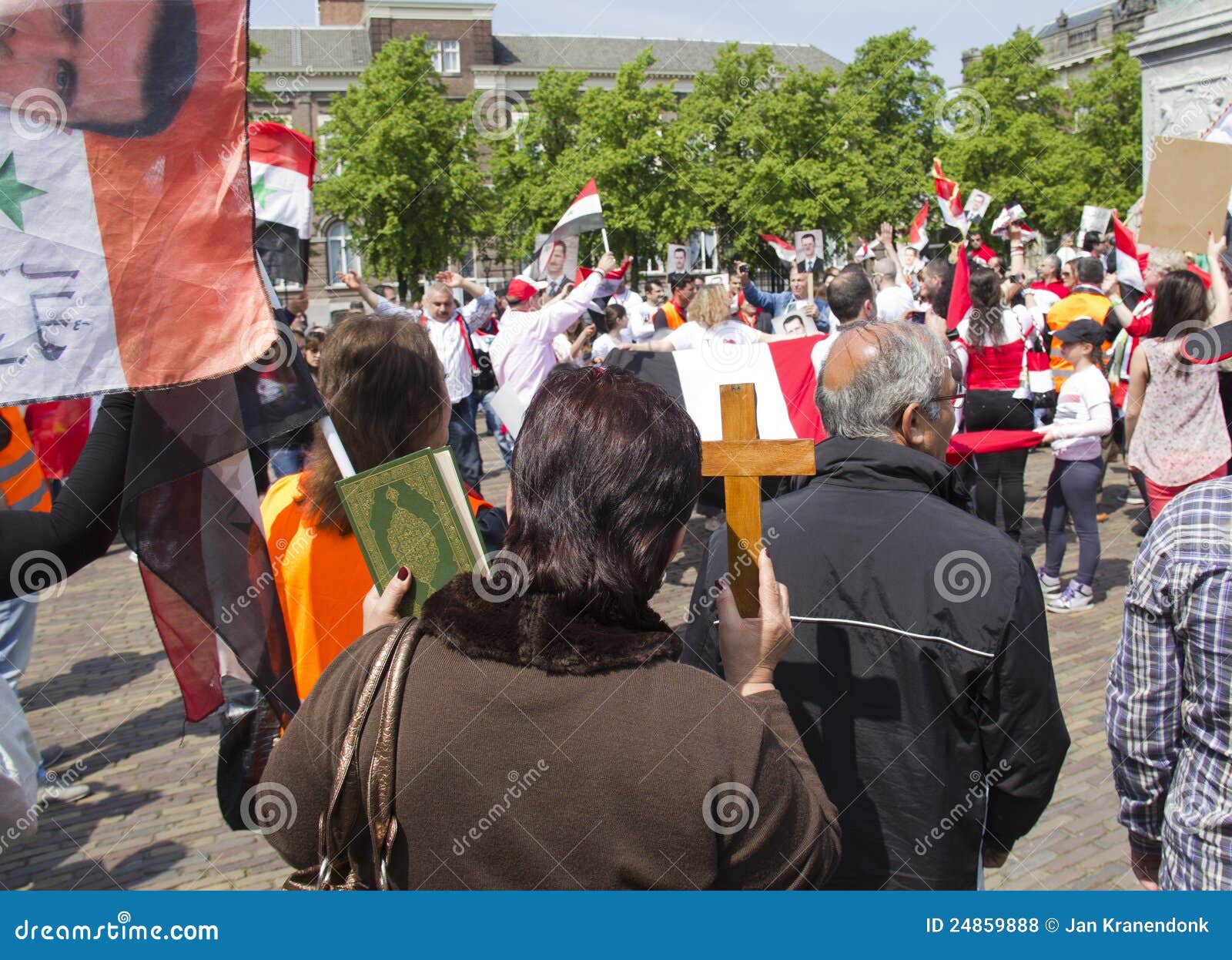 Koran and Cross editorial stock photo. Image of crowd - 24859888
