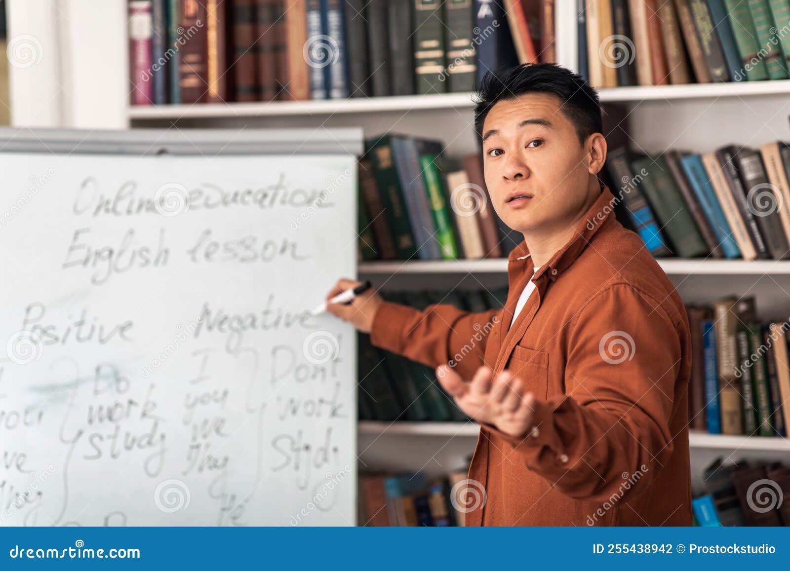 Korean Teacher Man Teaching Looking at Camera in Modern Classroom Stock ...