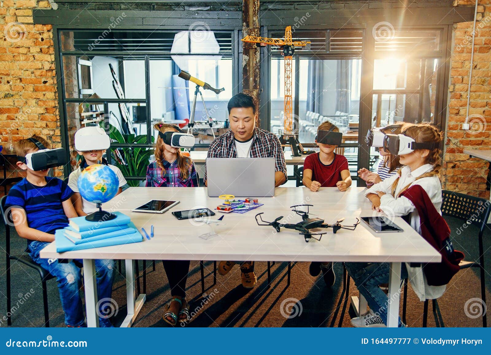 Korean Teacher with Six Caucasian Pupils Using Augmented Reality VR ...