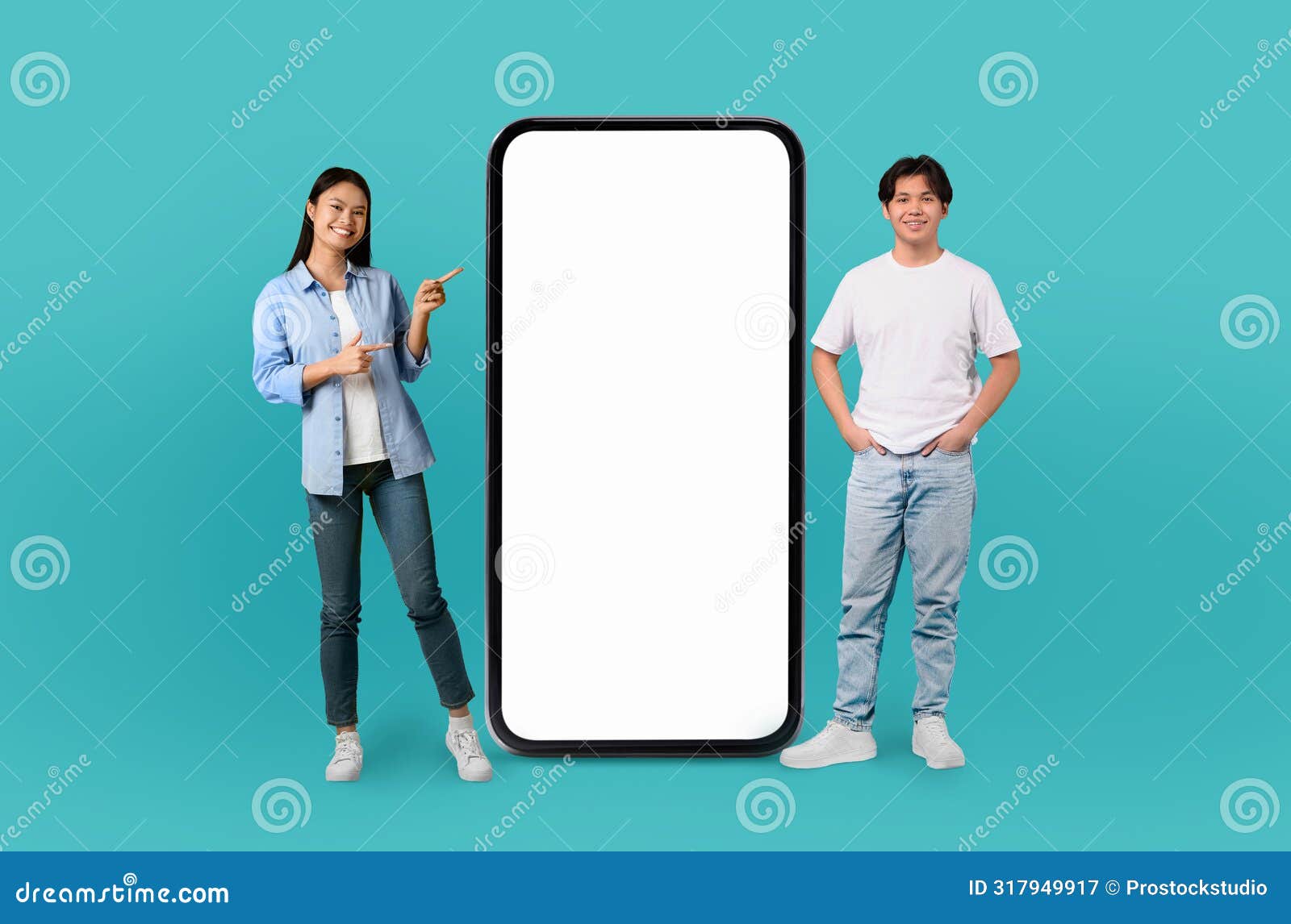 Korean Young Man and Woman Presenting a Giant Smartphone Stock Image ...