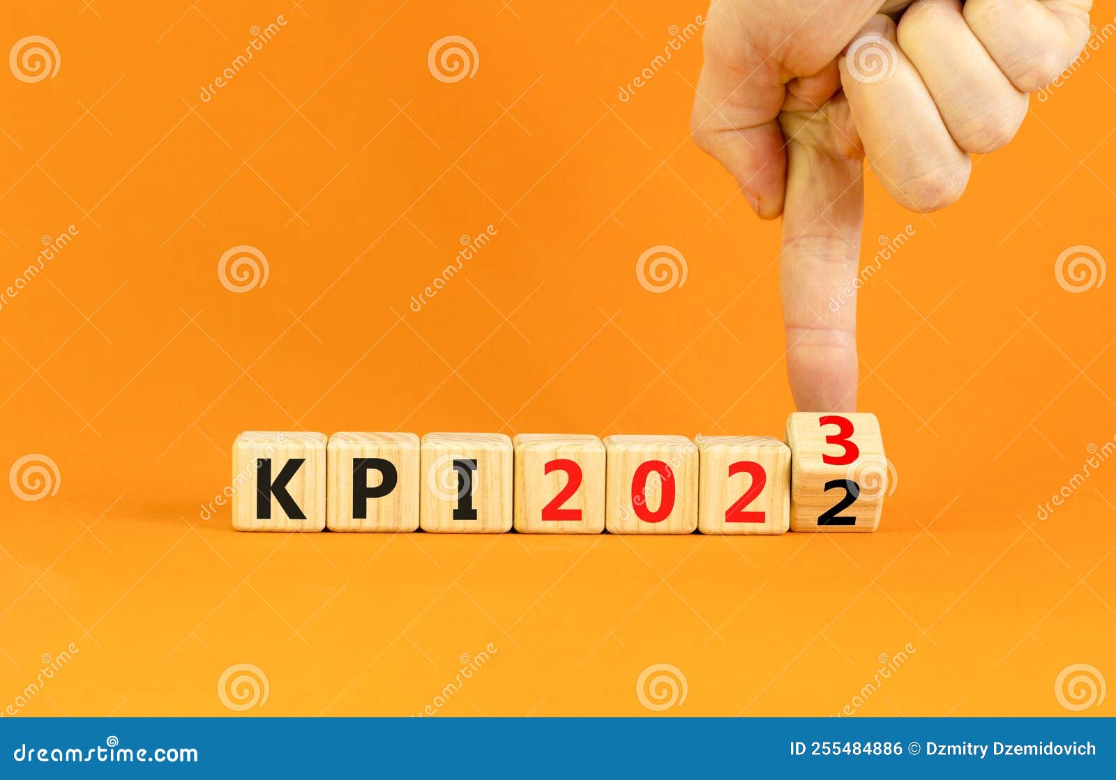 KPI, Key Performance Indicator Symbol. Businessman Turns Wooden Cubes ... KPI, Key Performance Indicator Symbol. Businessman Turns Wooden Cubes ...