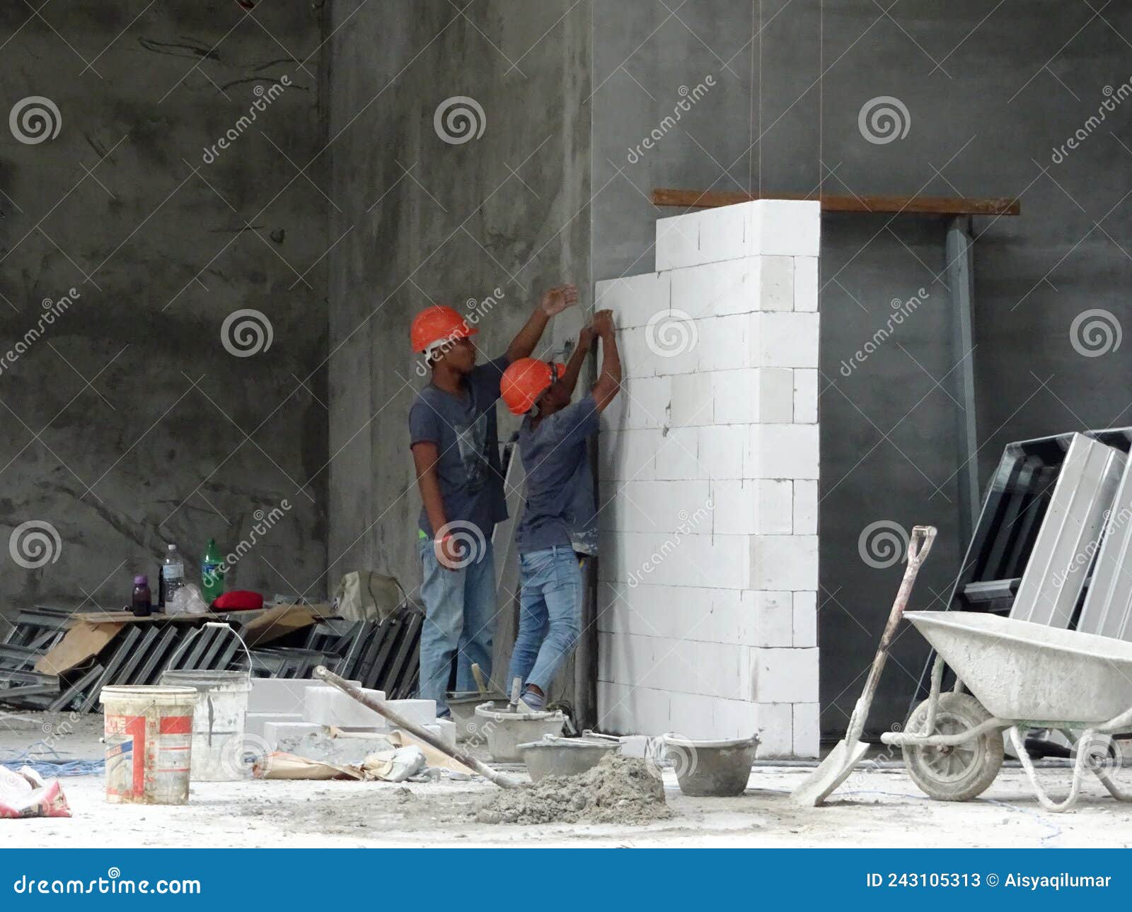 Brickwork by Construction Workers at the Construction Site. Editorial ...