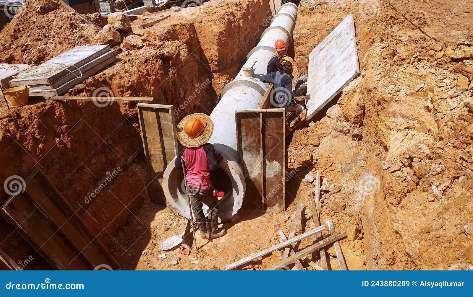 Construction Workers Install Concrete Pipe Culvert in the Underground ...