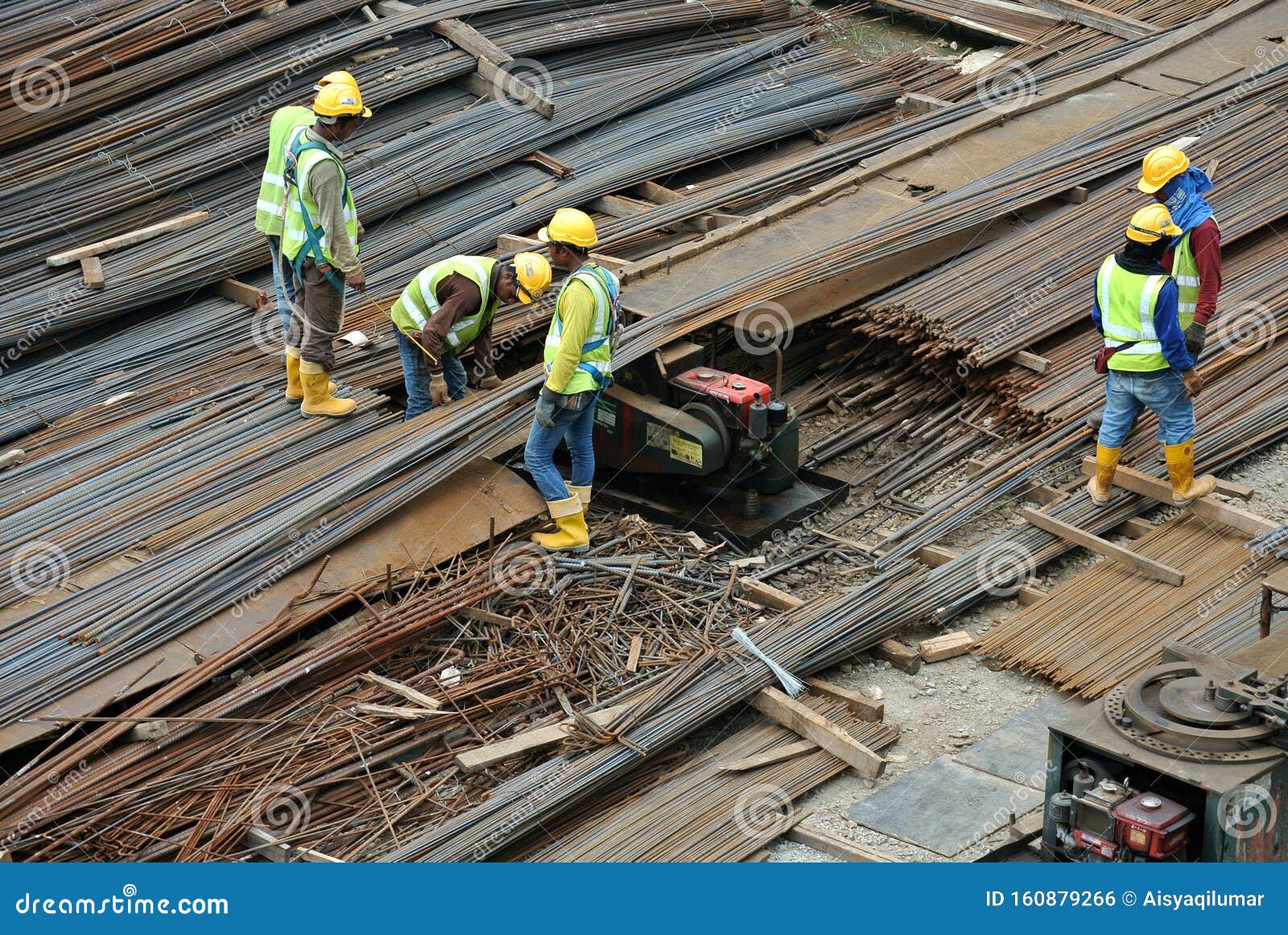 Construction Workers Working at the Steel Reinforcement Bar Bending ... Construction Workers Working at the Steel Reinforcement Bar Bending ...