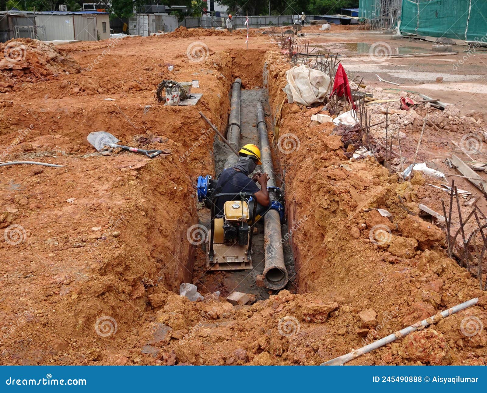 Underground Sewerage Pipe Installed by Construction Workers at the ...
