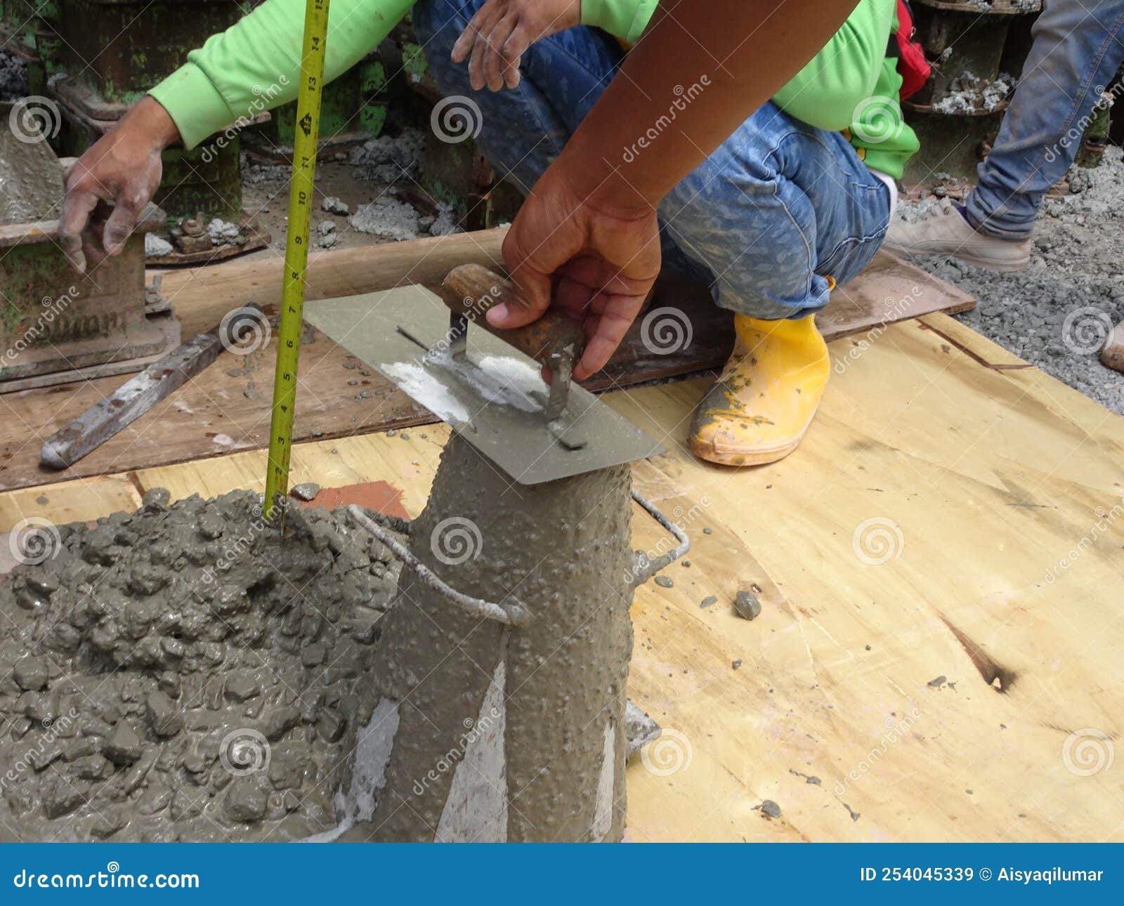 Construction Workers Doing Slump Test Using Appropriate Equipment at ...