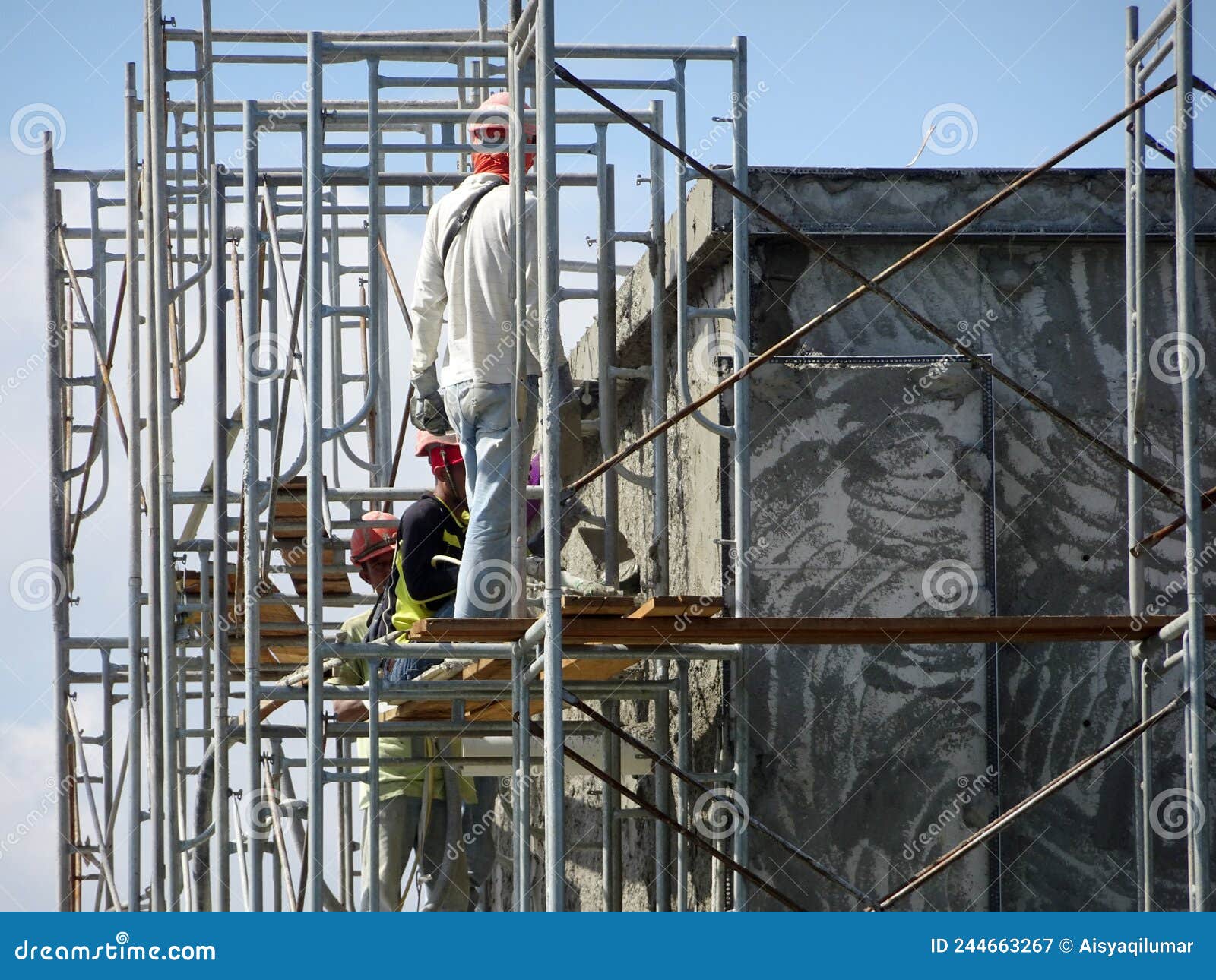 Construction Workers Plastering Wall Using Cement Plaster at the ...