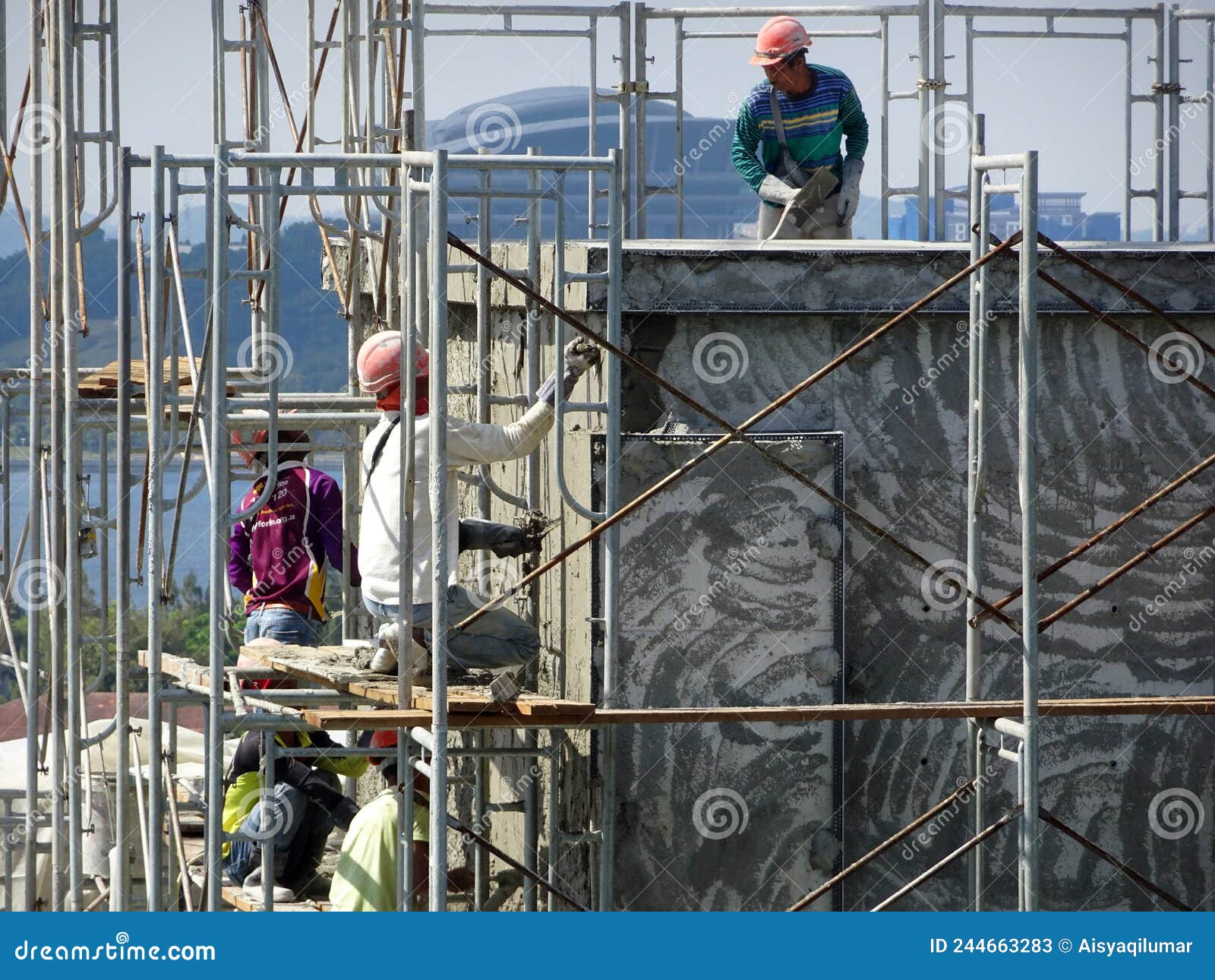 Construction Workers Plastering Wall Using Cement Plaster at the ...