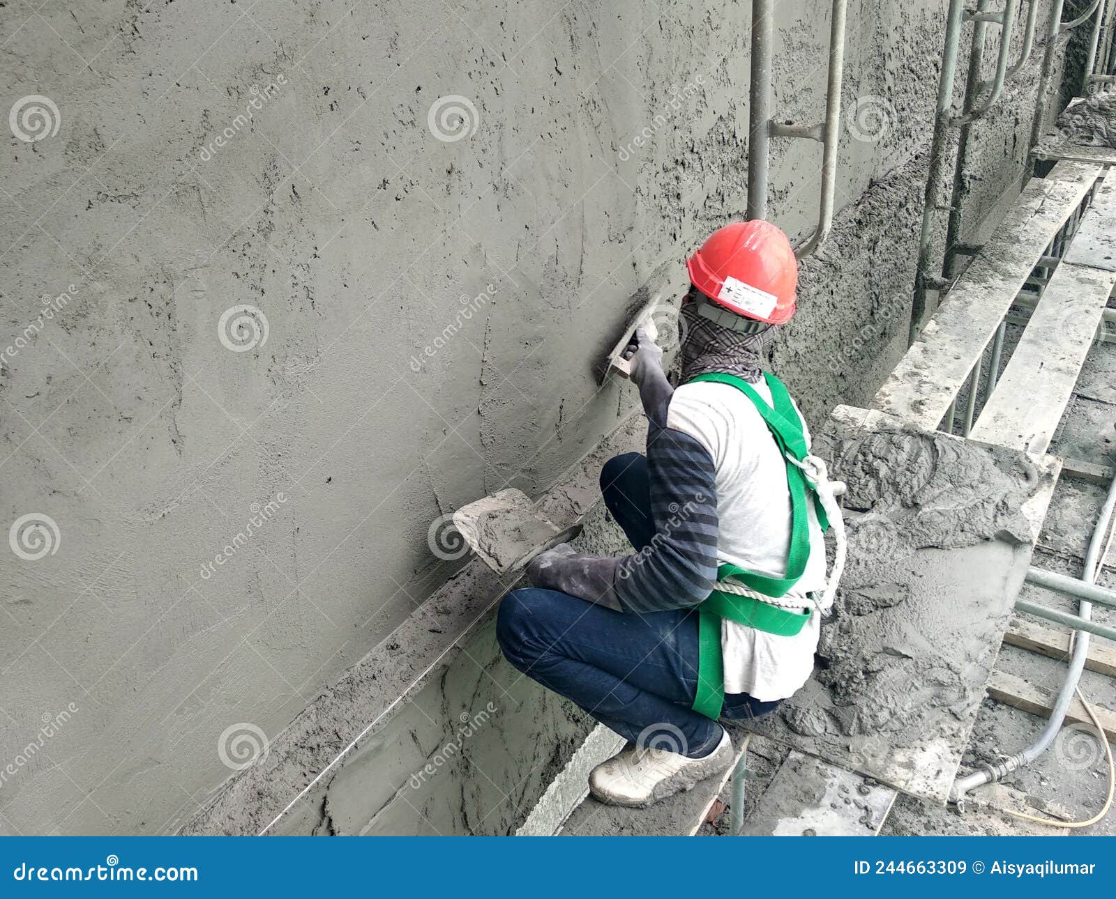 Construction Workers Plastering Wall Using Cement Plaster at the ...