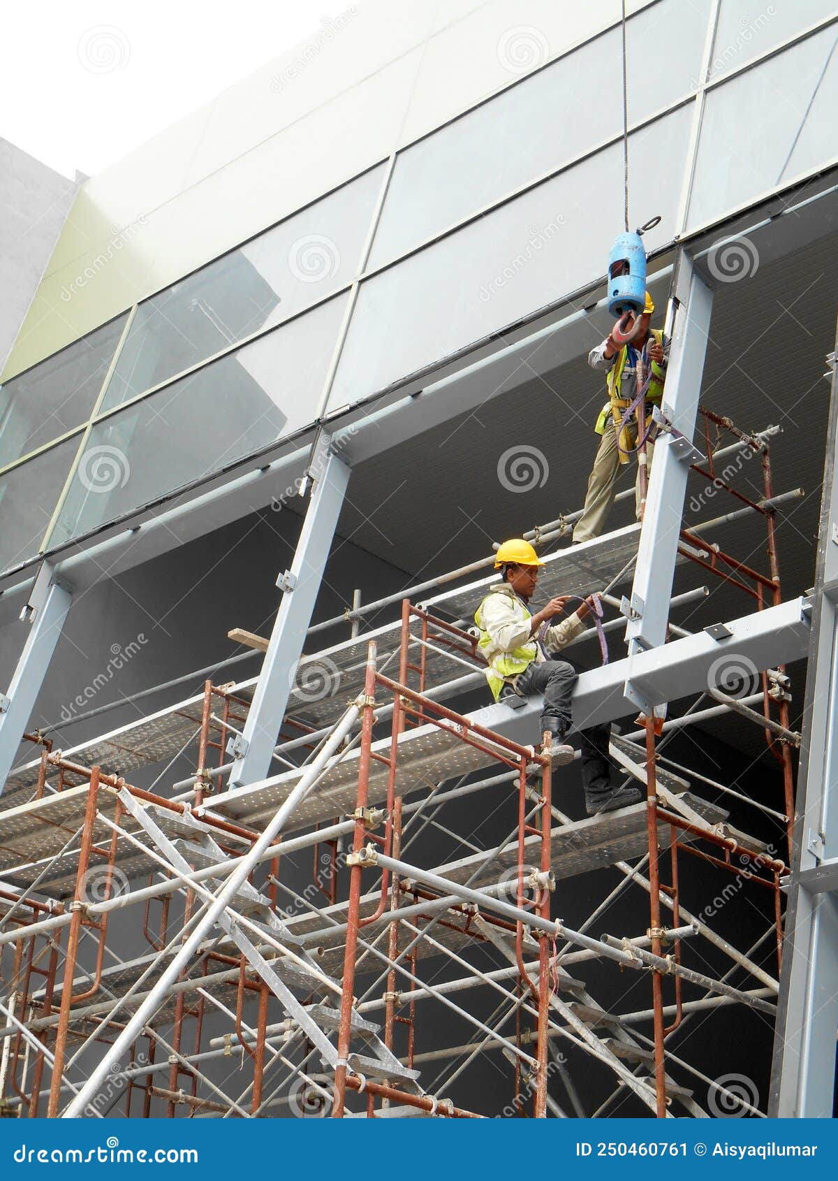 Construction Workers Working at Height at the Construction Site ...