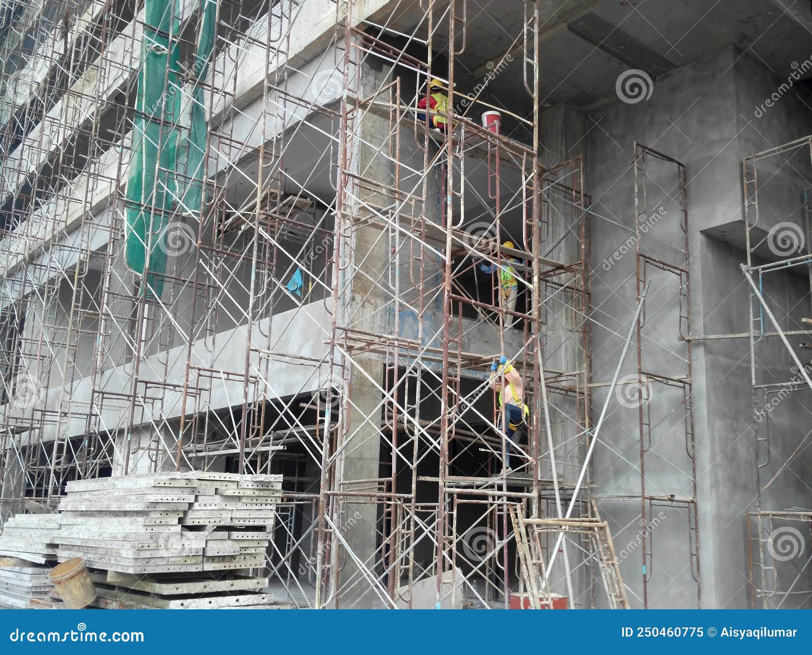 Construction Workers Working at Height at the Construction Site ...
