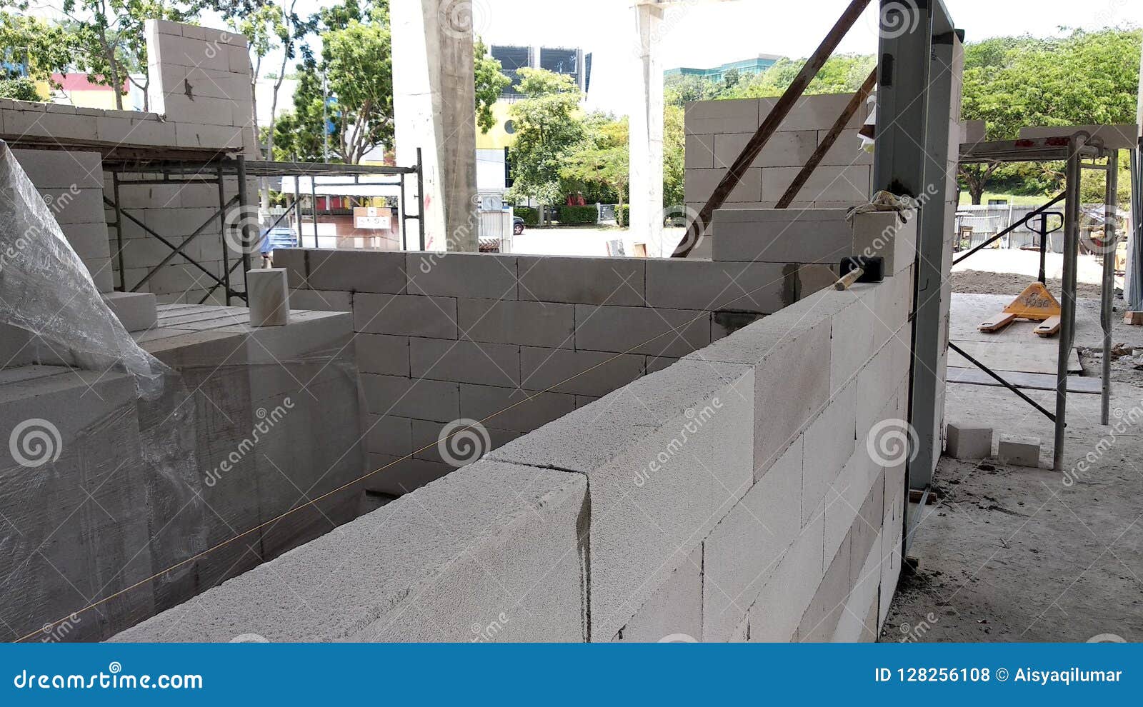 Brickwork by Construction Workers at the Construction Site. Editorial ...