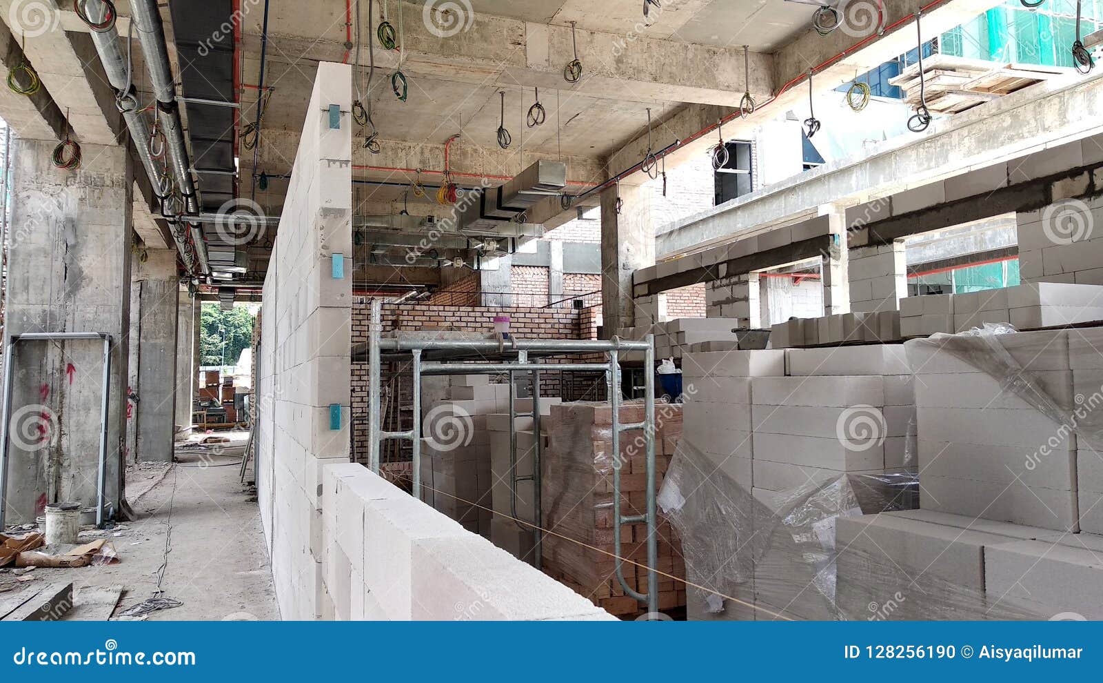 Brickwork by Construction Workers at the Construction Site. Editorial ...