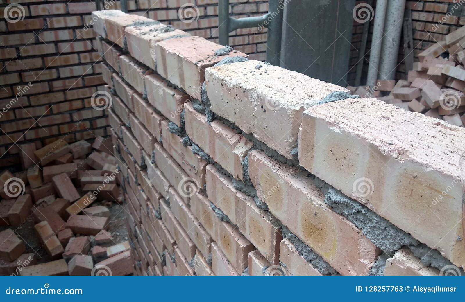Brickwork by Construction Workers at the Construction Site. Editorial ...