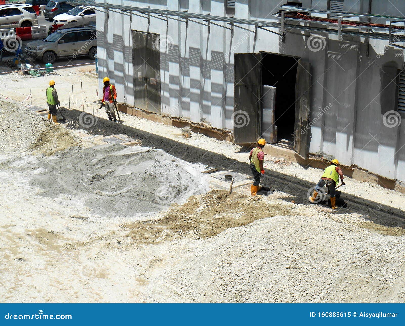 Construction Workers Creating Concrete Road Curb at the Construction ...