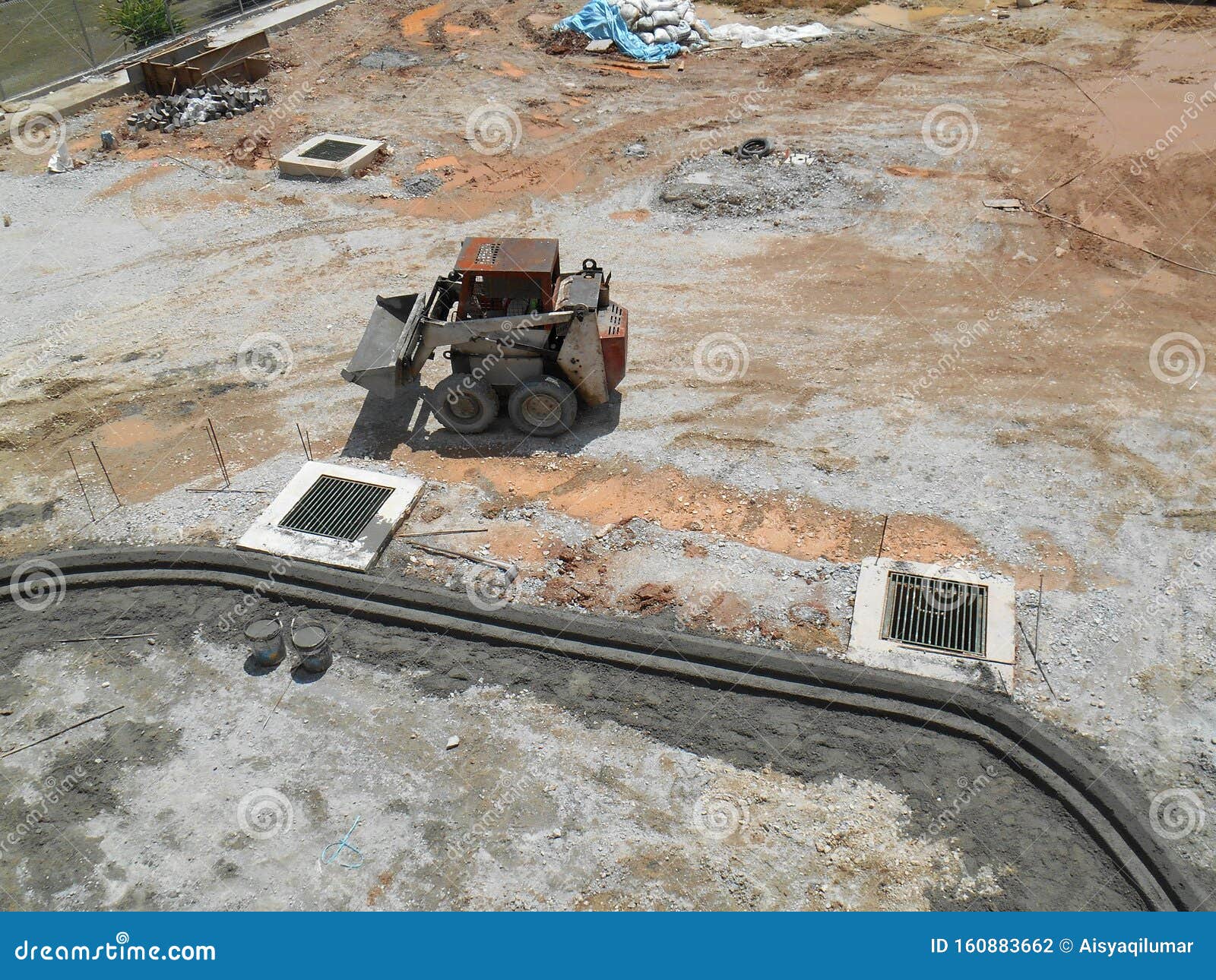 Construction Workers Creating Concrete Road Curb at the Construction ...