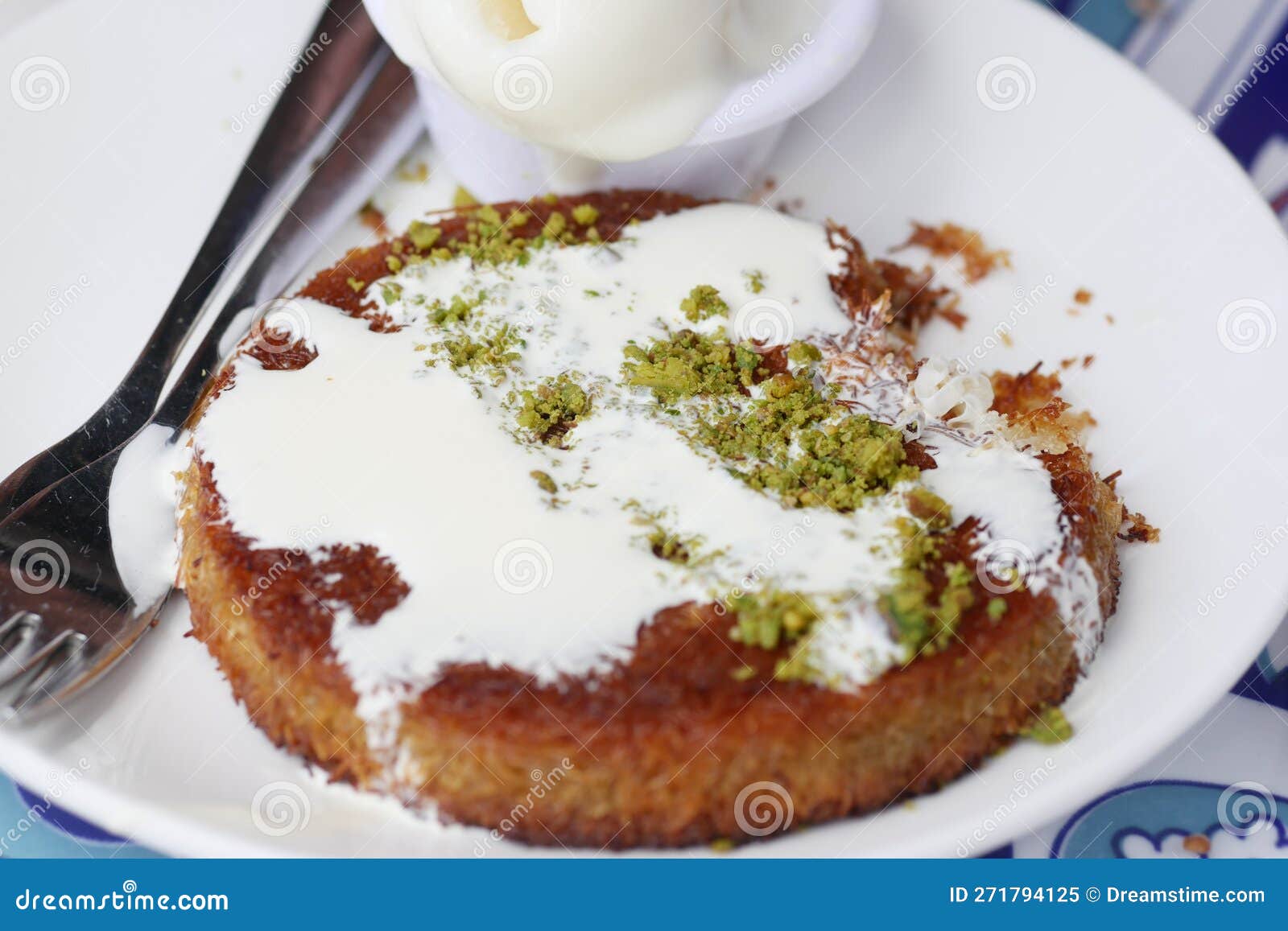 Kunafa with a Wipe Cream on a Plate . Stock Image - Image of tasty ...