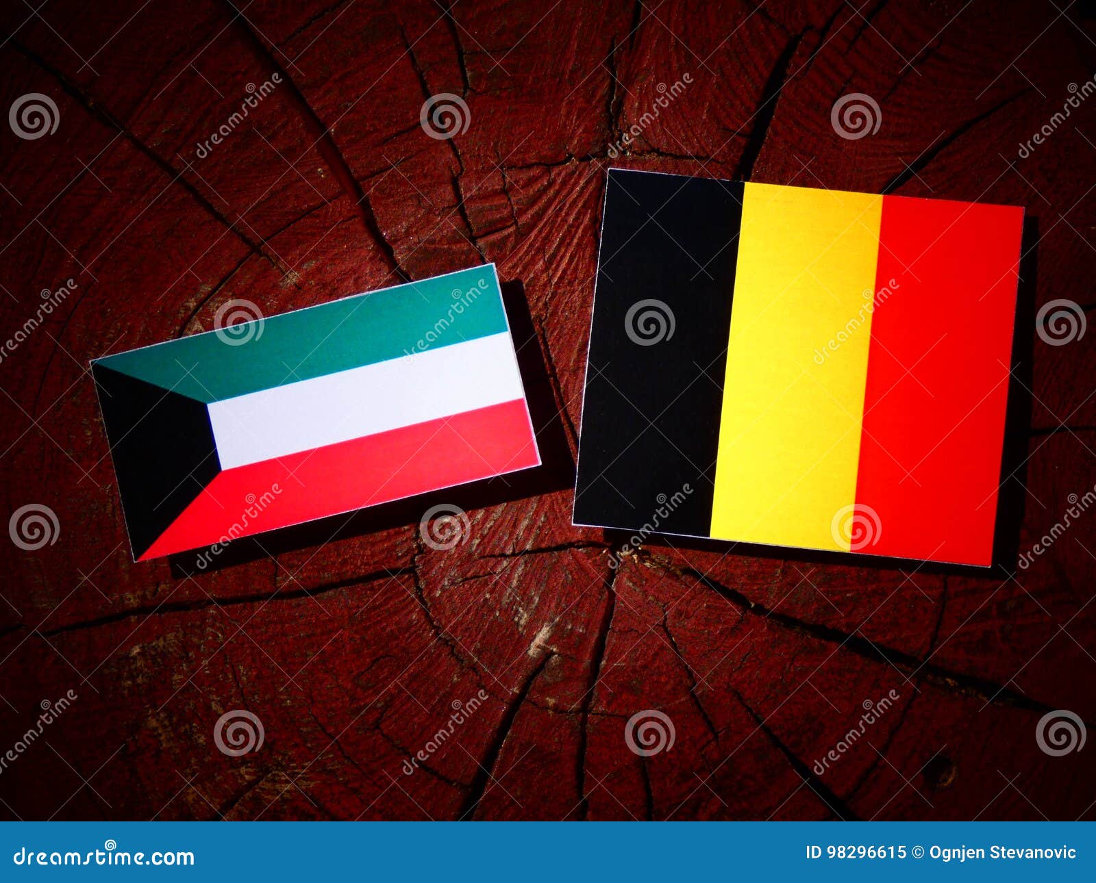 Kuwaiti Flag with Belgian Flag on a Tree Stump Isolated Stock Image ...