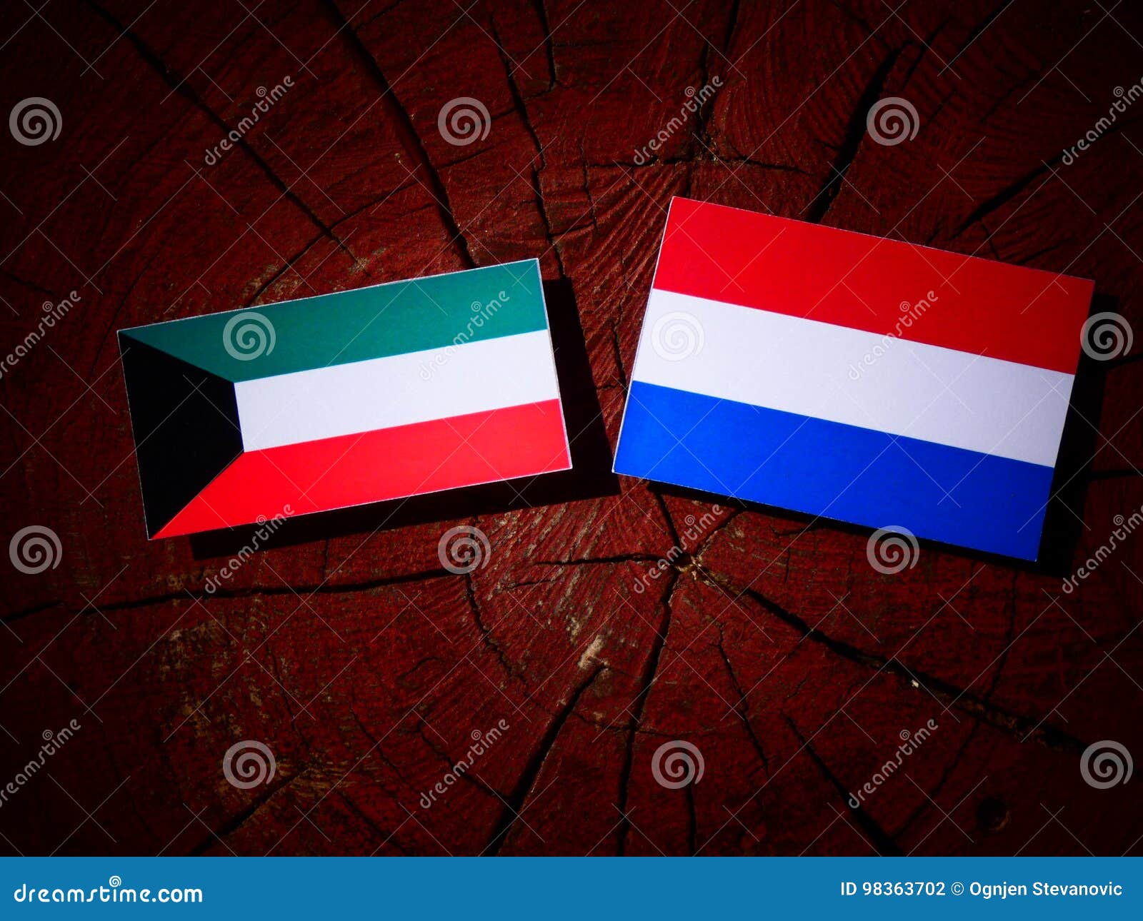 Kuwaiti Flag with Dutch Flag on a Tree Stump Isolated Stock Photo ...