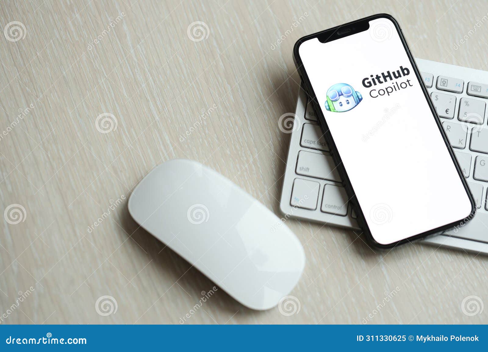 KYIV, UKRAINE - MARCH 17, 2024 Github Copilot Logo on IPhone Display Screen with Apple Keyboard ...