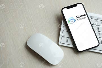 KYIV, UKRAINE - MARCH 17, 2024 Github Copilot Logo on IPhone Display Screen with Apple Keyboard ...
