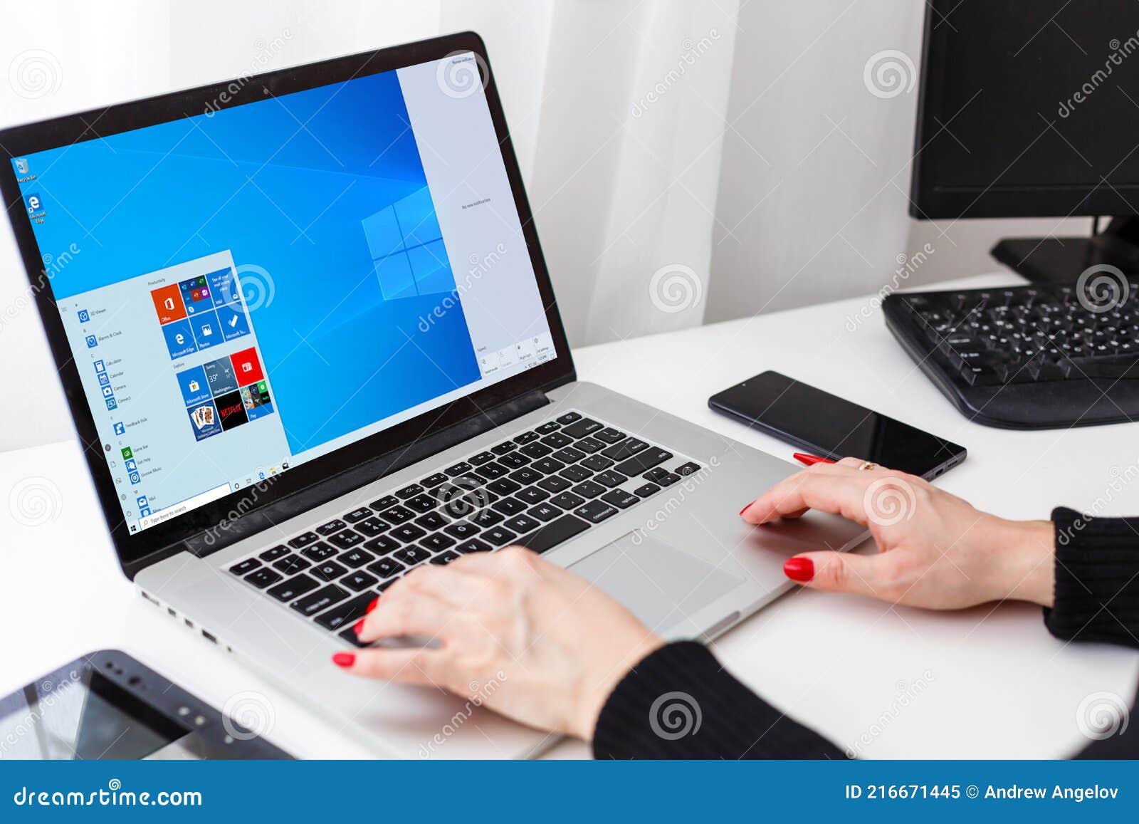 Kyiv, Ukraine - March 27, 2021. Notebook with Microsoft Windows 10 Logo ...