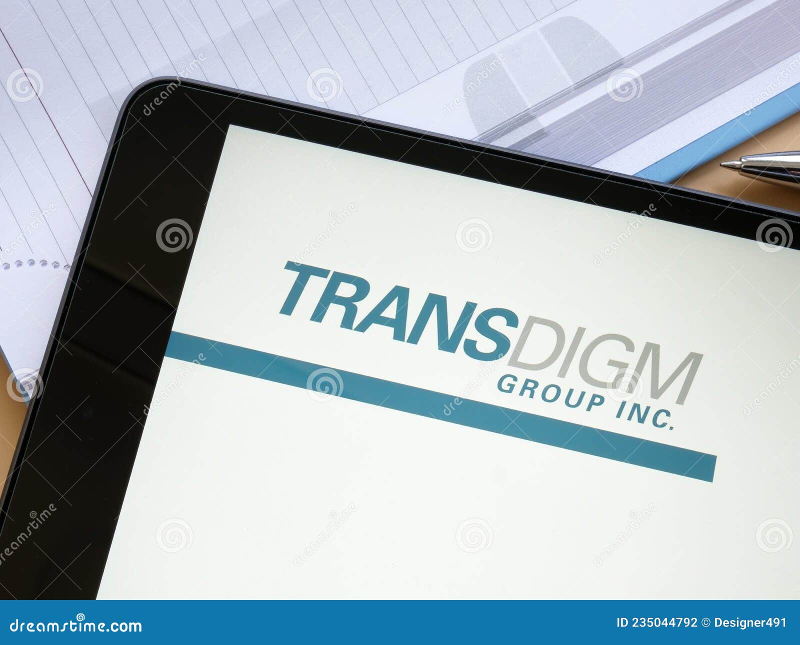 KYIV, UKRAINE - October 21, 2021. TransDigm Group Inc Logo and Notebook ...