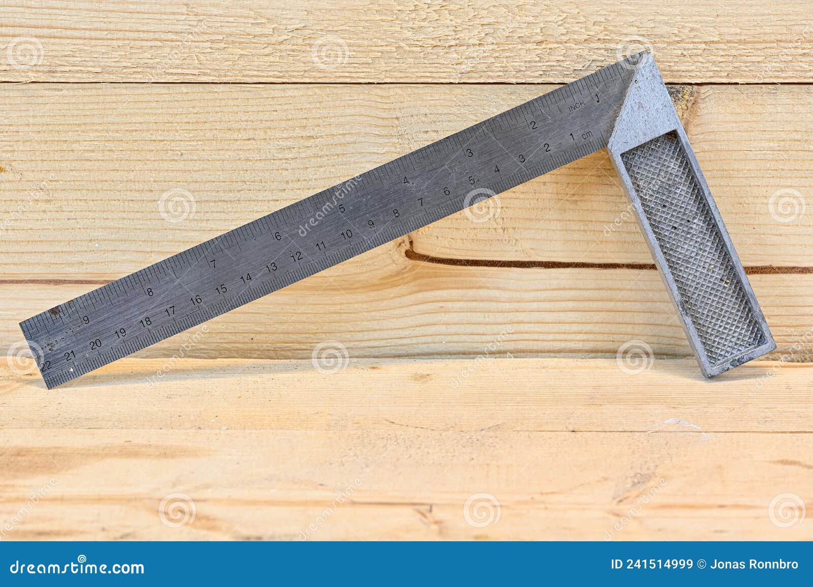 L Square of Metal Standing on Wooden Bench Stock Image - Image of ...