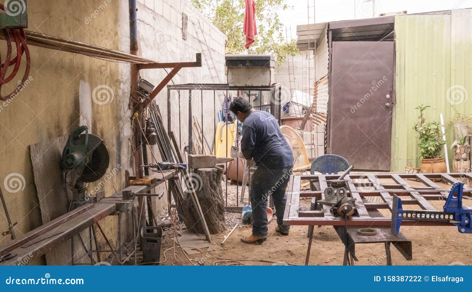 Blacksmith Working in a Backyard Workshop, La Paz, Baja California ...