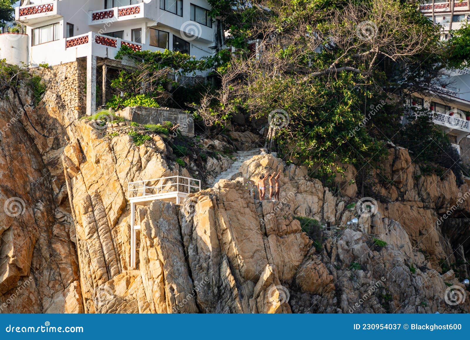 Famous Divers Wave As they Prepare To Jump and Dive Off a Tall Cliff in ...