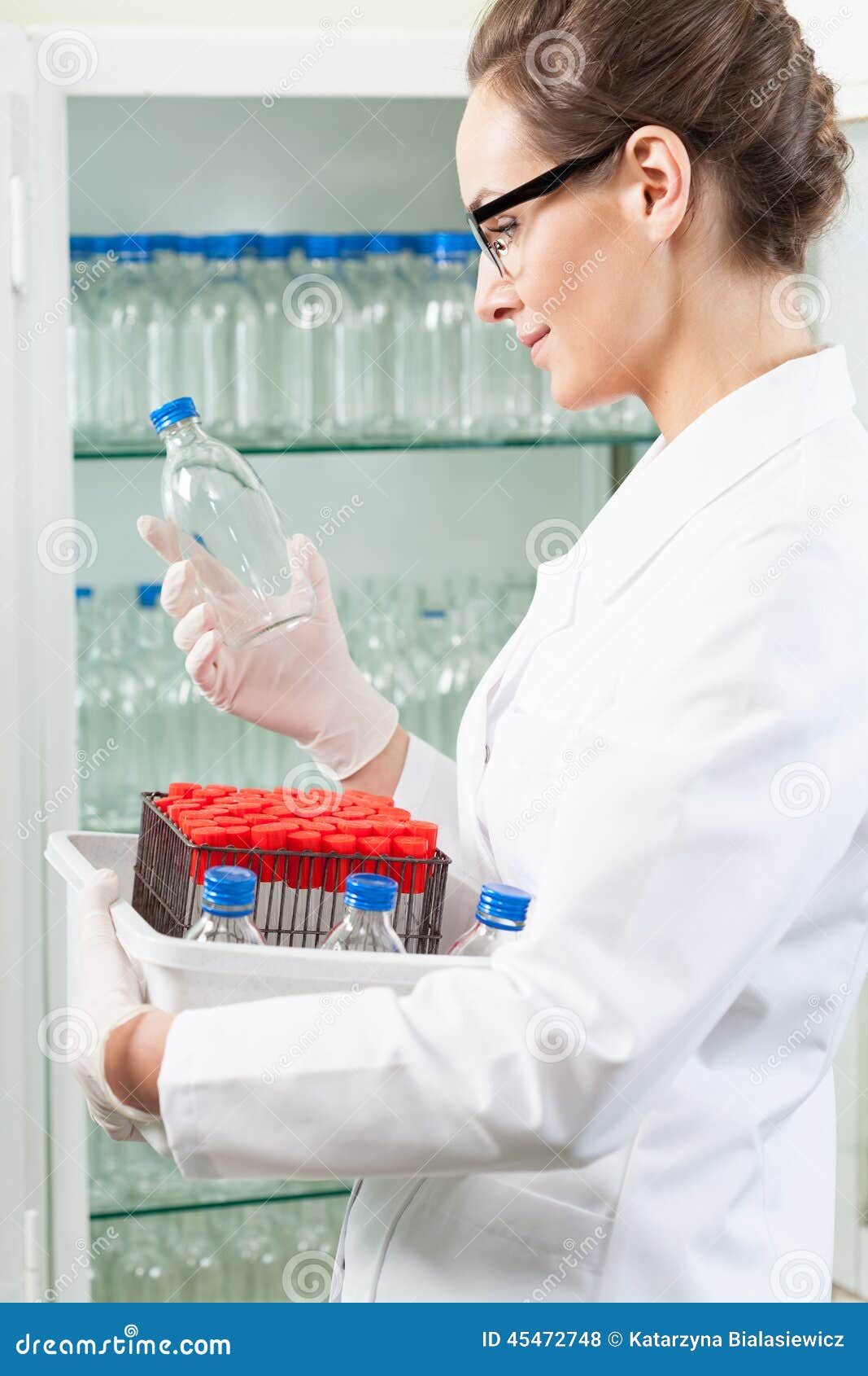 Lab assistant holding box stock photo. Image of door - 45472748