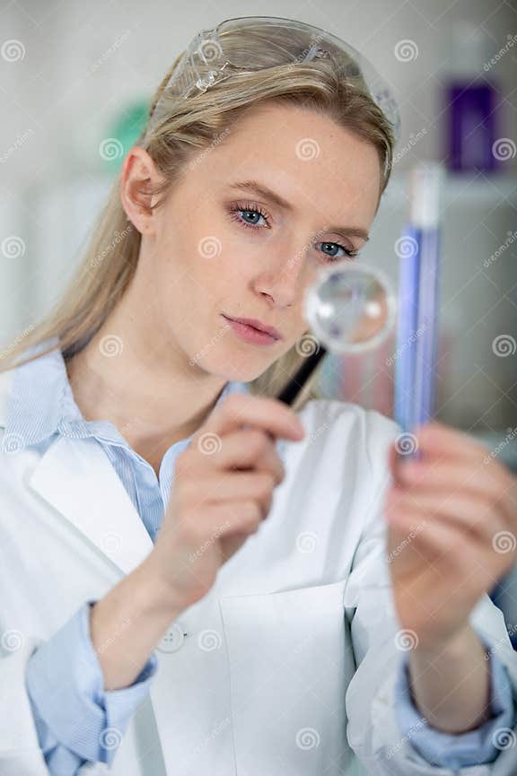 Lab Assistant with Magnifying Glass Stock Photo - Image of biology ...