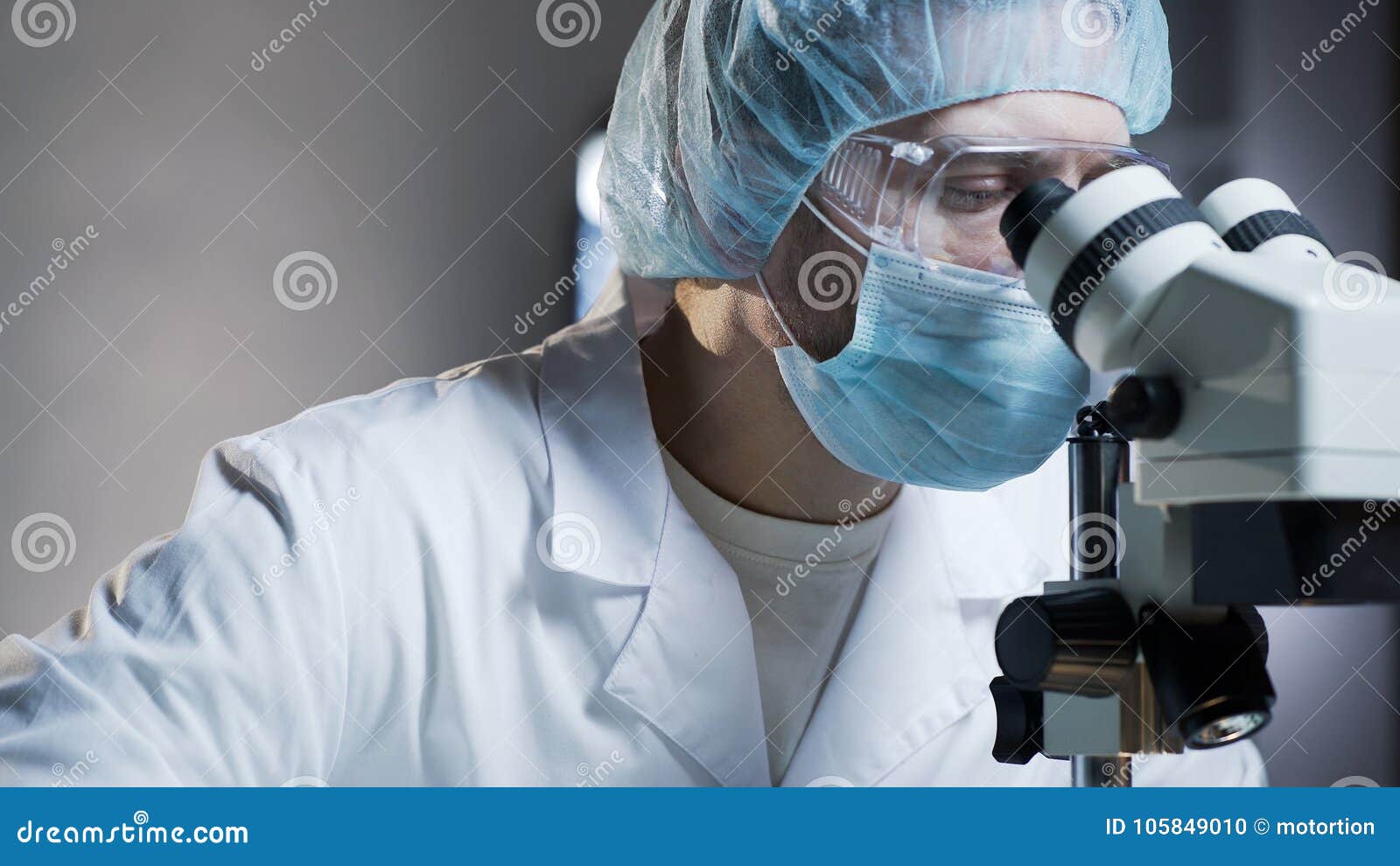 Lab Assistant Viewing Samples in Microscope, Conducting Chemical ...