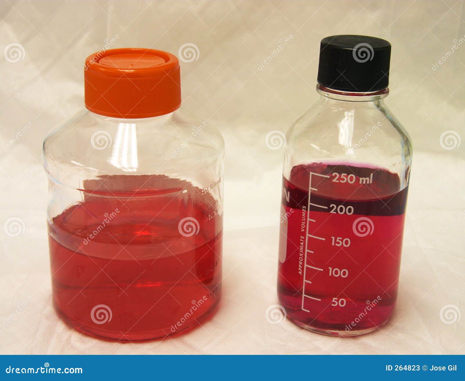 Lab Bottles with Red Media stock image. Image of biologist - 264823