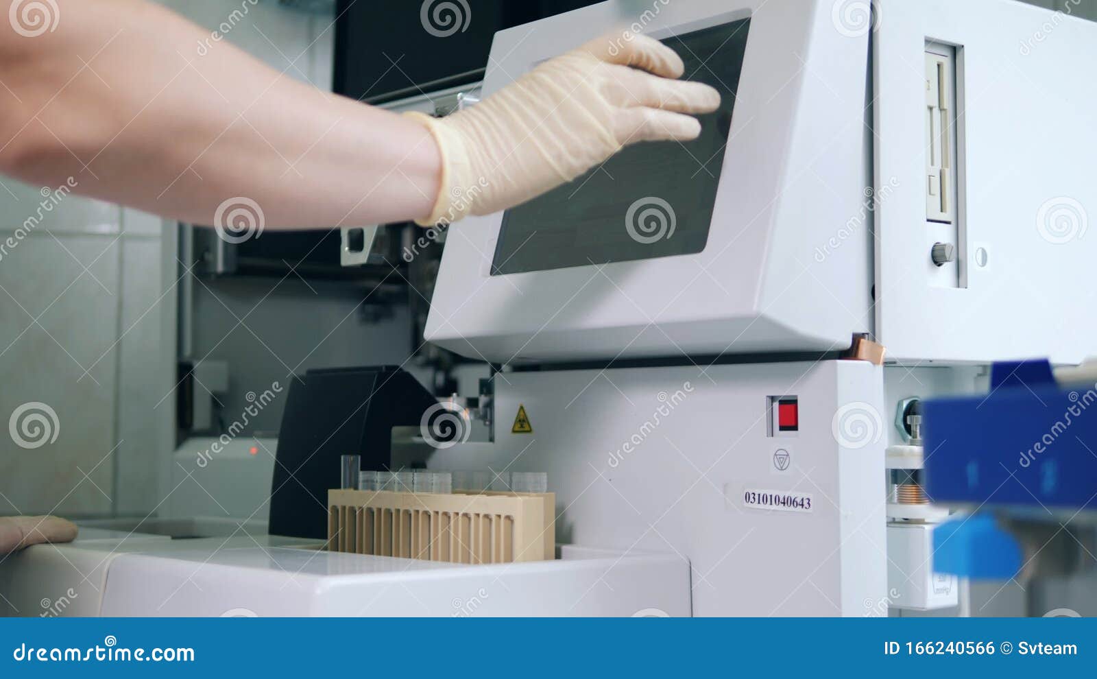 Lab Expert is Loading Test Tubes into the Analyzer Stock Footage ...