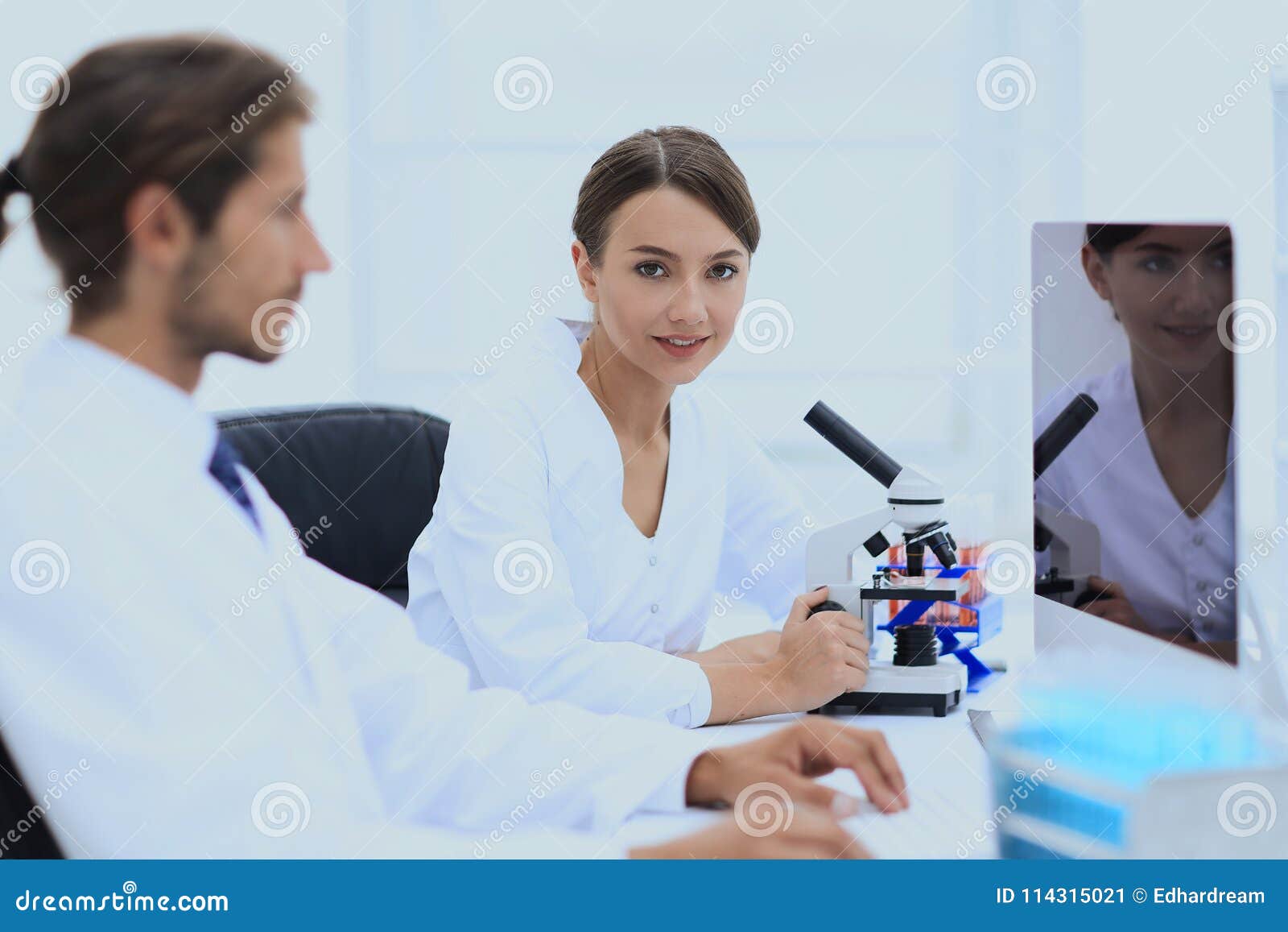 Lab Expert Working on a Test Using Microscope Stock Image - Image of ...