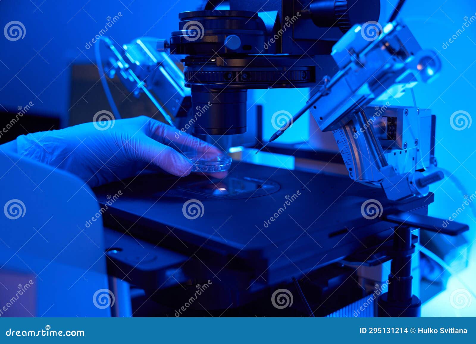 LAb Researcher Preparing for Cell Manipulation with Micromanipulator in ...