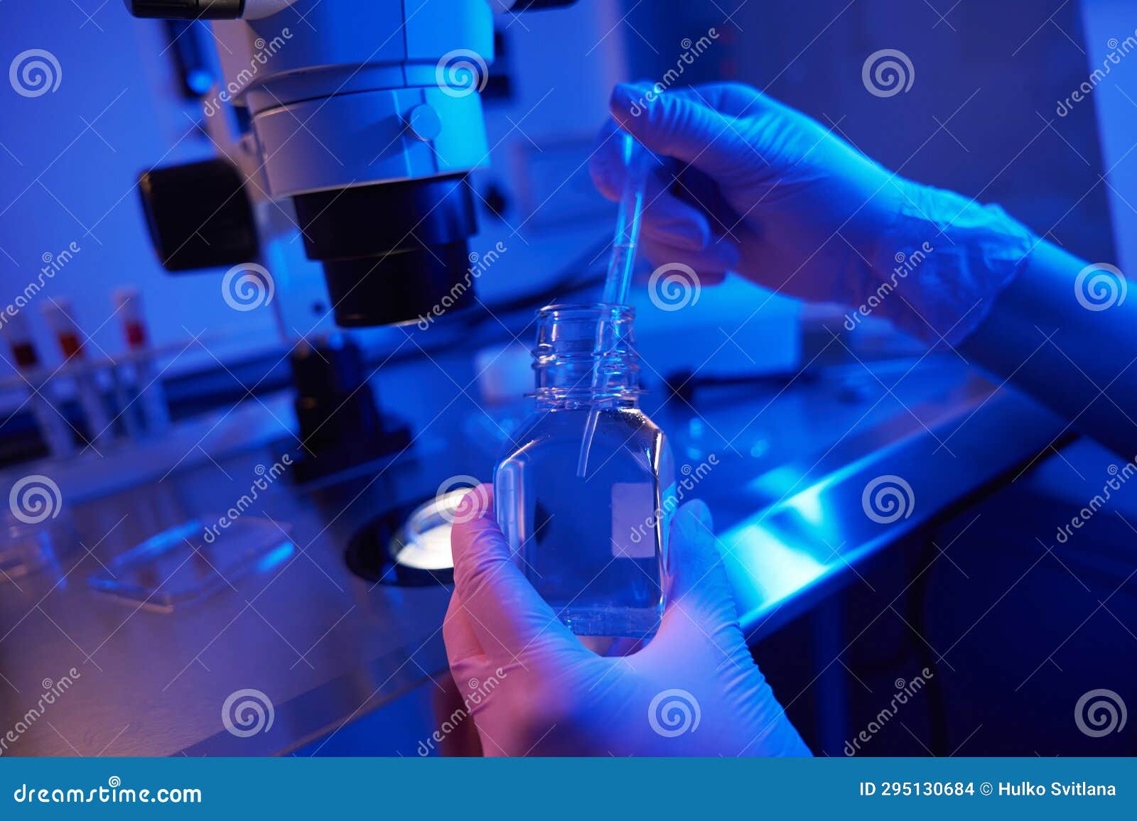 Lab Scientist Aspirating Liquid with Pasteur Pipette from Reagent ...