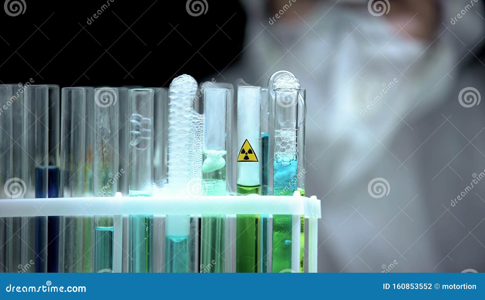 Lab Scientist Looking at Test Tubes with Radioactive Sample Ecological ...
