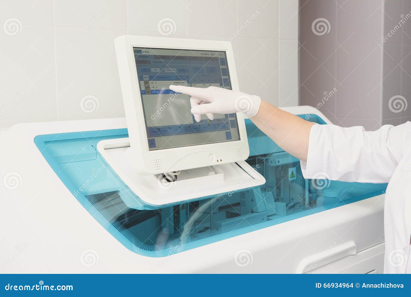 Lab Tech Loading Samples into a Chemistry Analyzer Stock Photo - Image ...