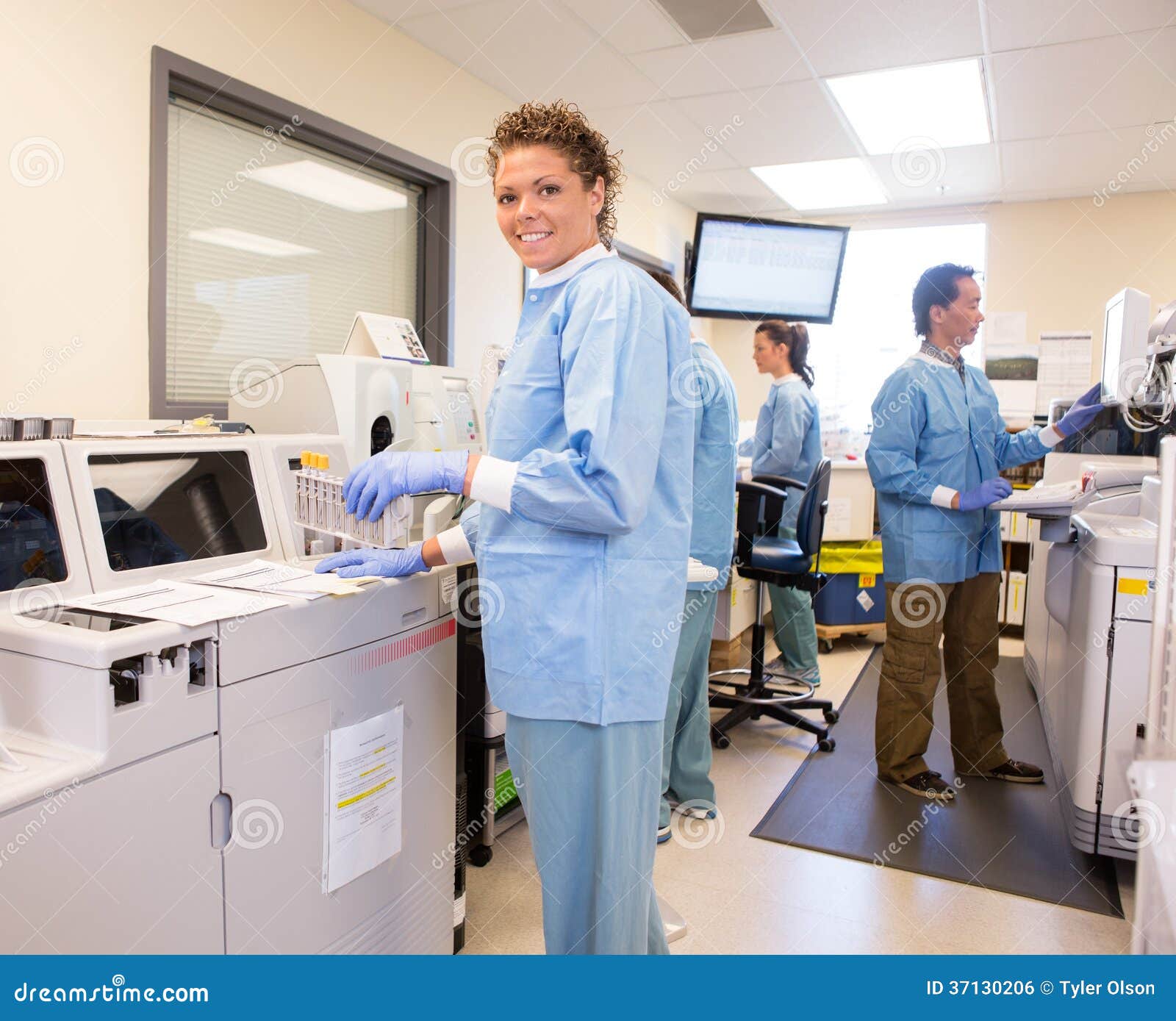 Lab Tech Using Backup Chemistry Analyzer Stock Photo - Image of female ...