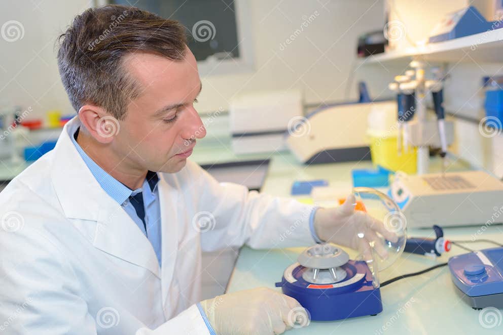 Lab Technican Setting Up Centrifugal Machine Stock Image - Image of ...
