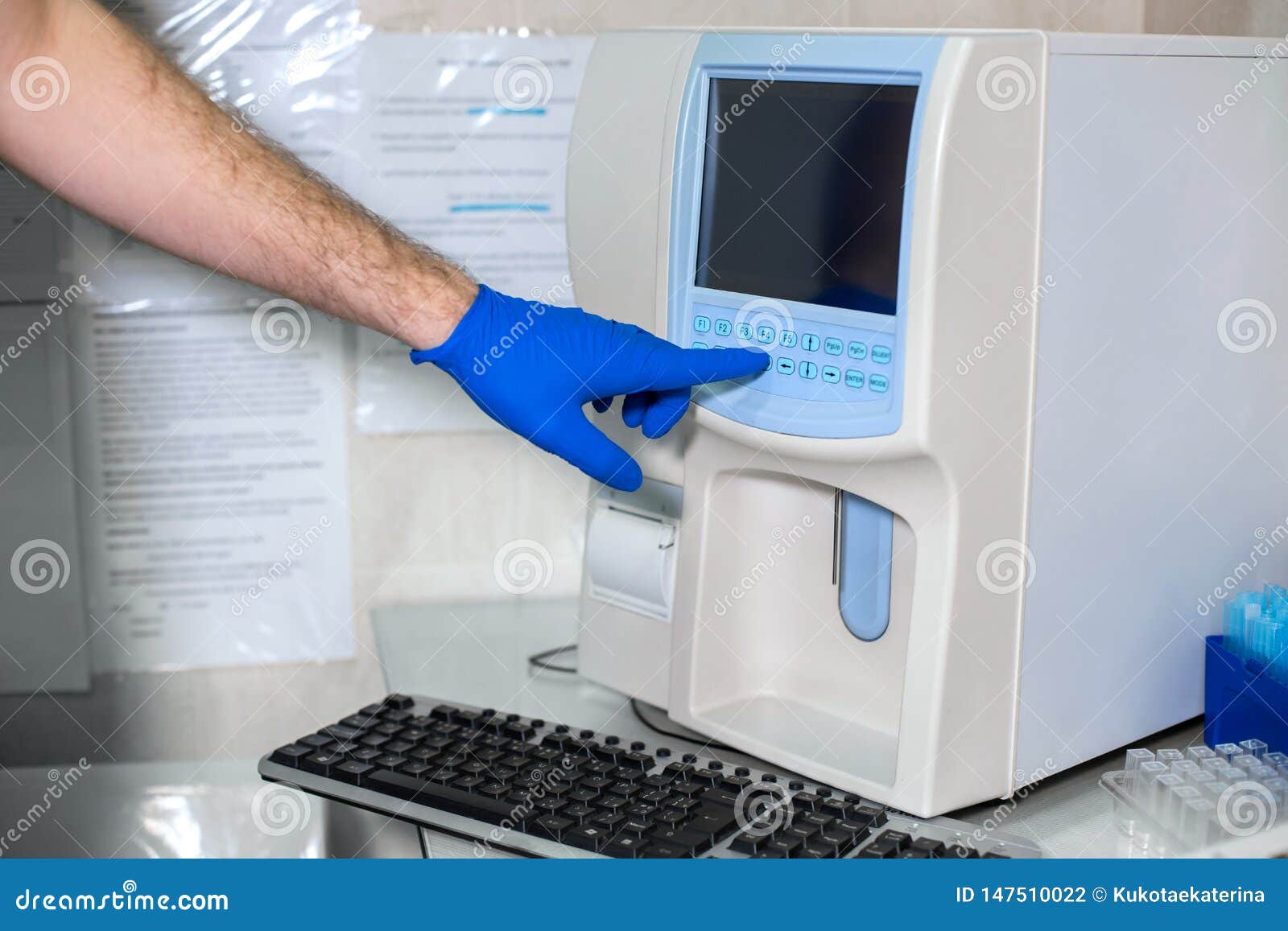 Lab Technician Adjusts Device of Very Accurate Medical Blood Test ...