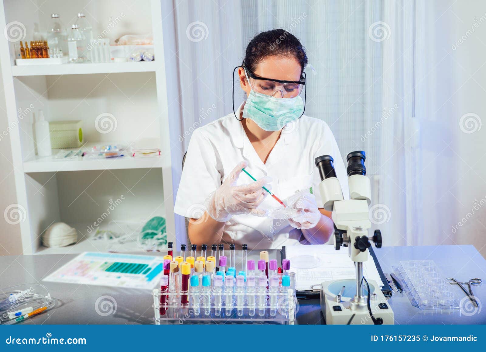 Lab Technician Assistant Analyzing a Blood Sample at Laboratory. Stock ...