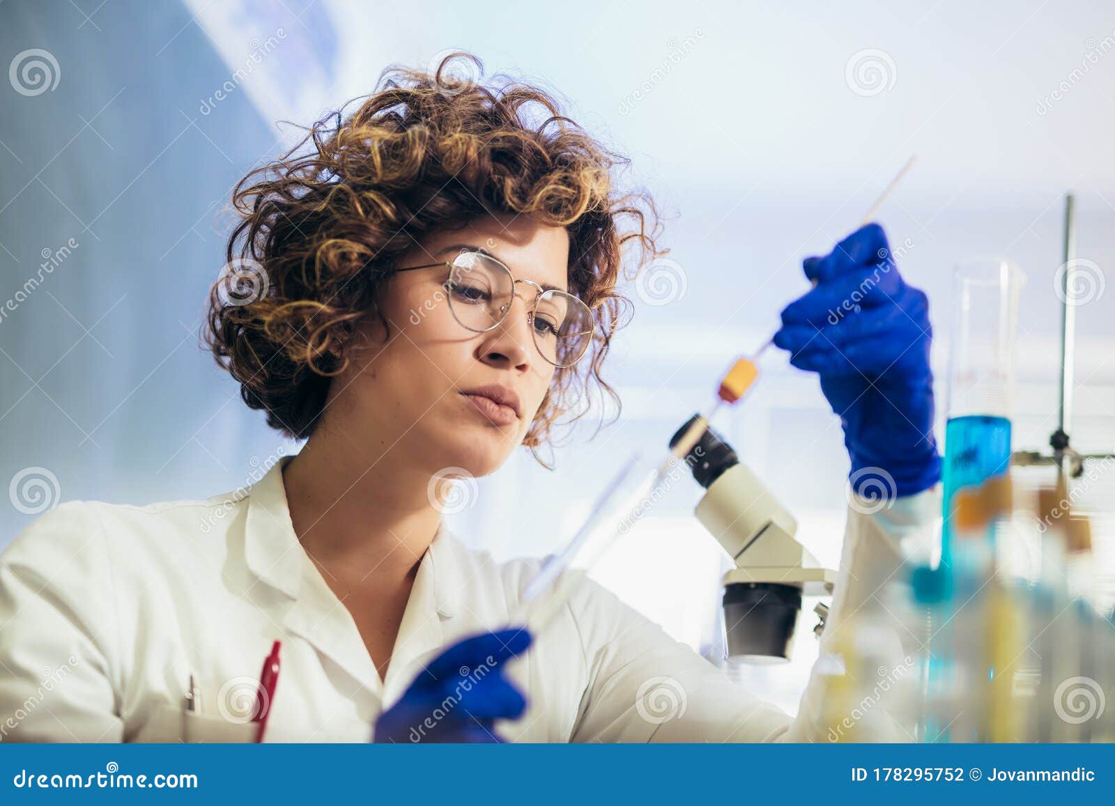 Lab Technician Assistant Analyzing a Blood Sample at Laboratory. Stock ...