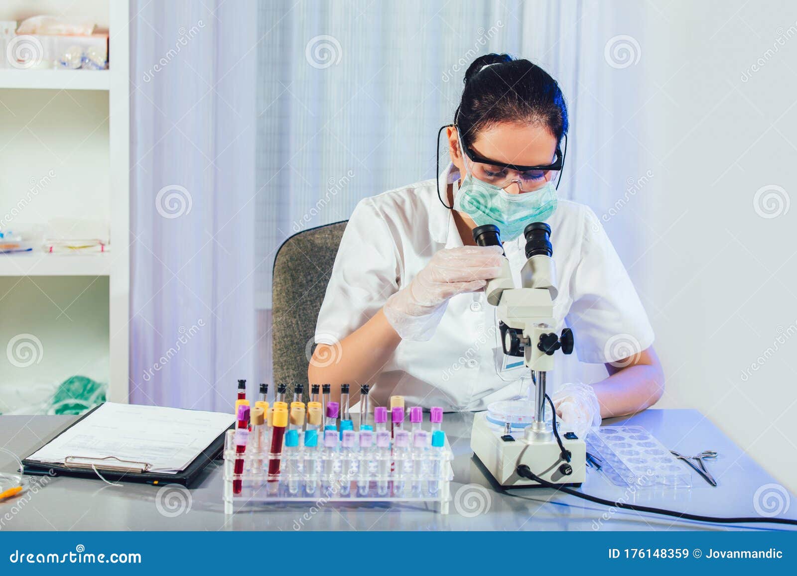 Lab Technician Assistant Analyzing a Blood Sample at Laboratory. Stock ...