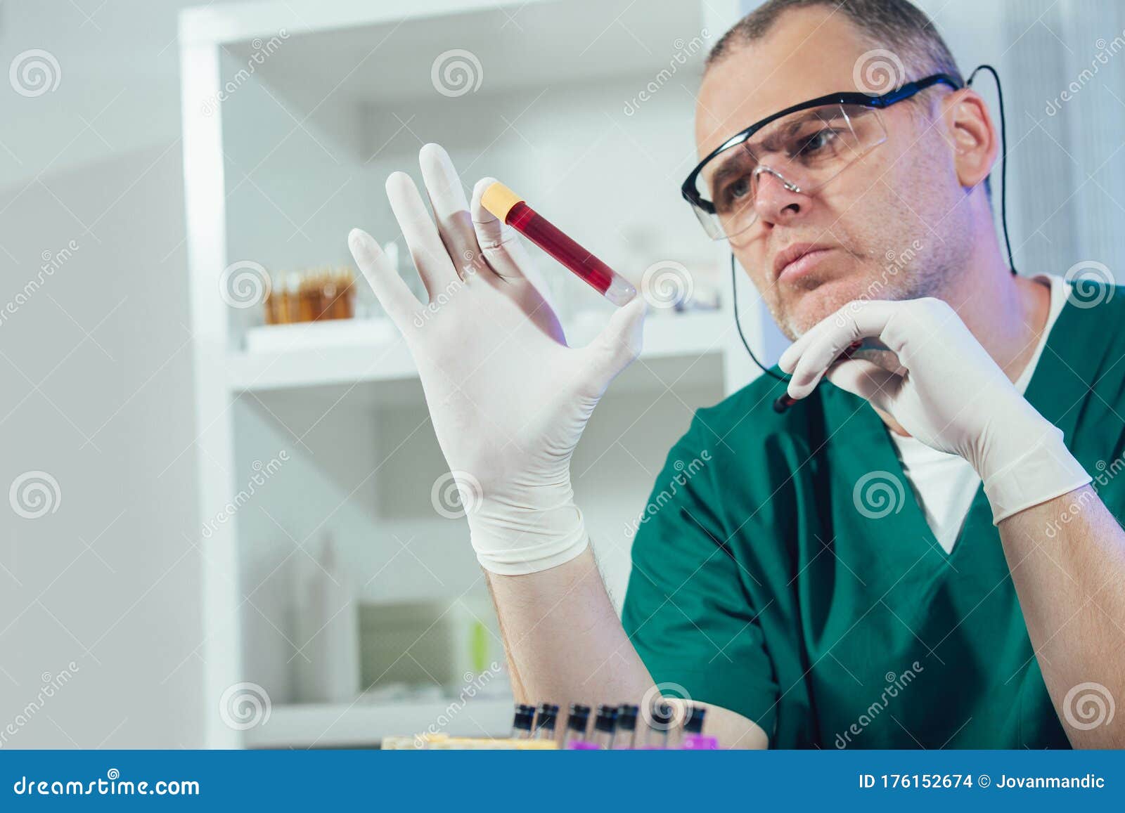 Lab Technician Assistant Analyzing a Blood Sample at Laboratory. Stock ...