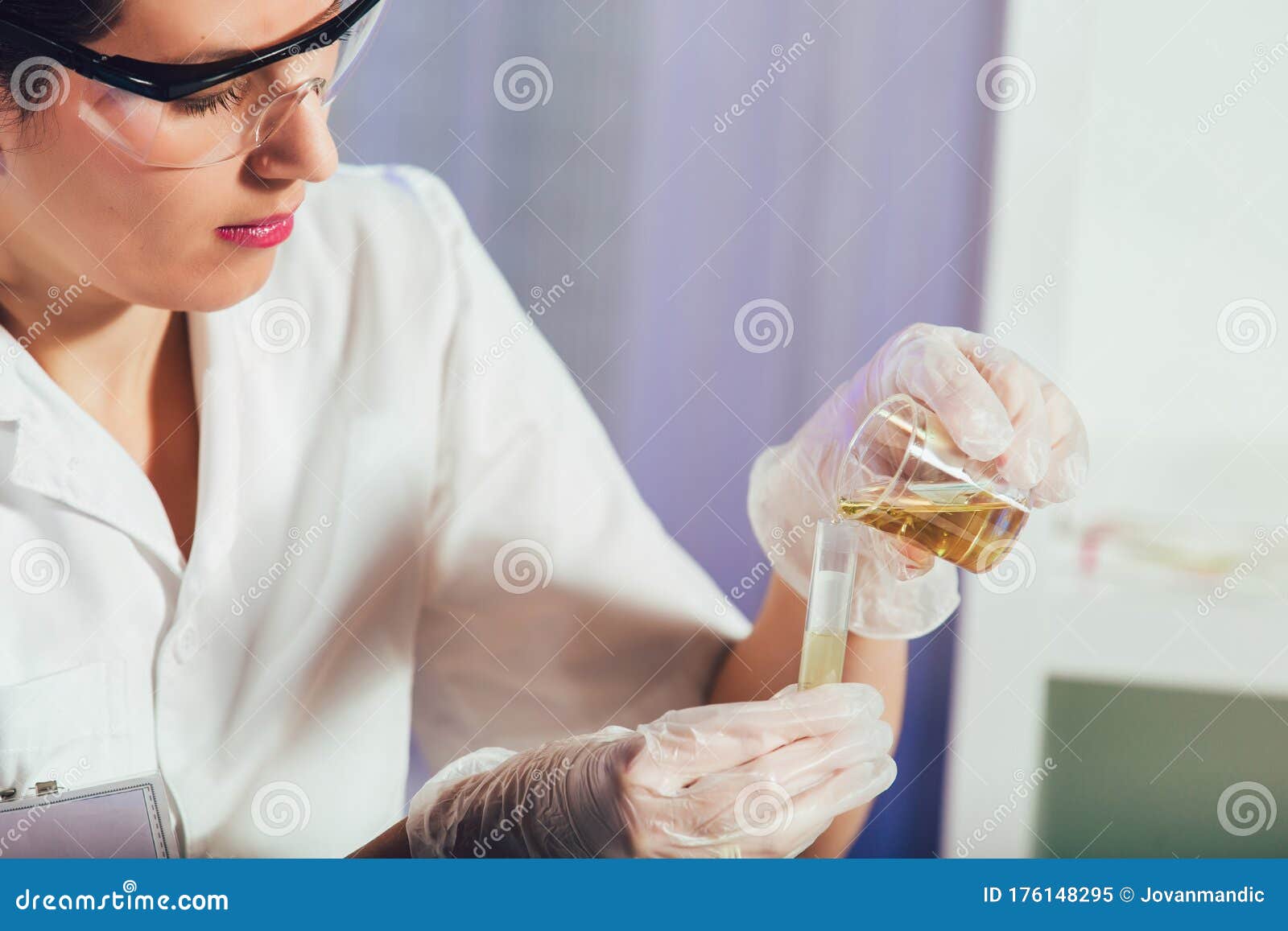 Lab Technician Assistant Analyzing A Blood Sample At Laboratory ...